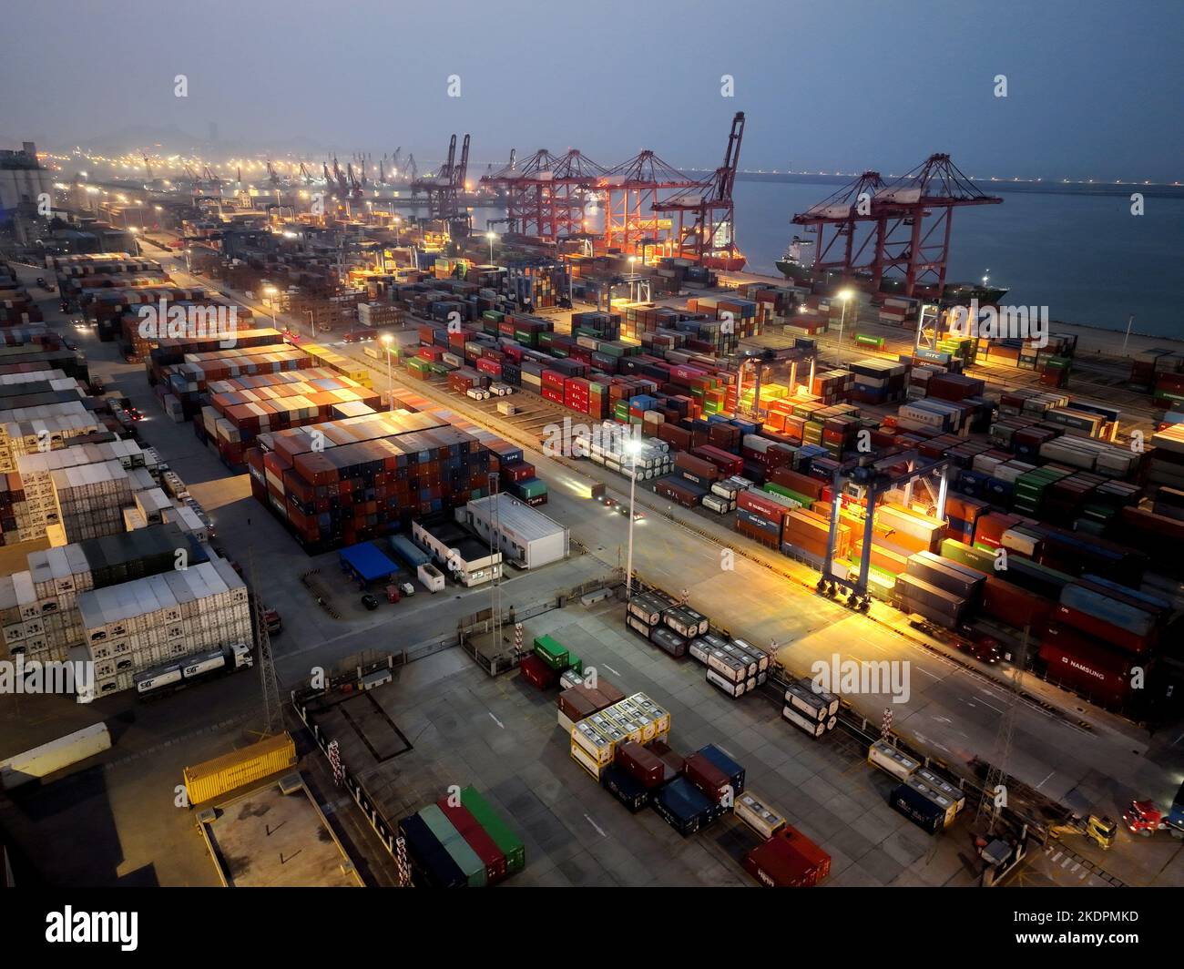 Large machinery is carrying out cargo at night in Lianyungang City ...