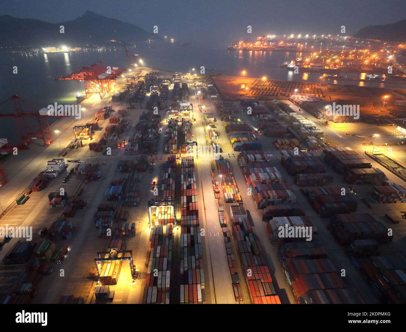 Large machinery is carrying out cargo at night in Lianyungang City ...