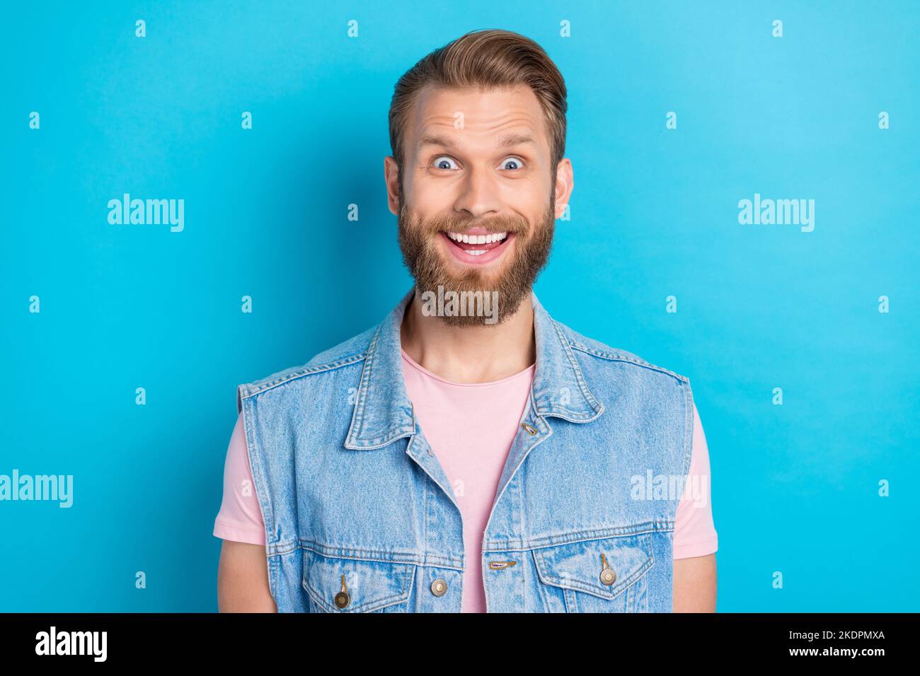 Photo of impressed excited young man wear jeans waistcoat smiling big ...