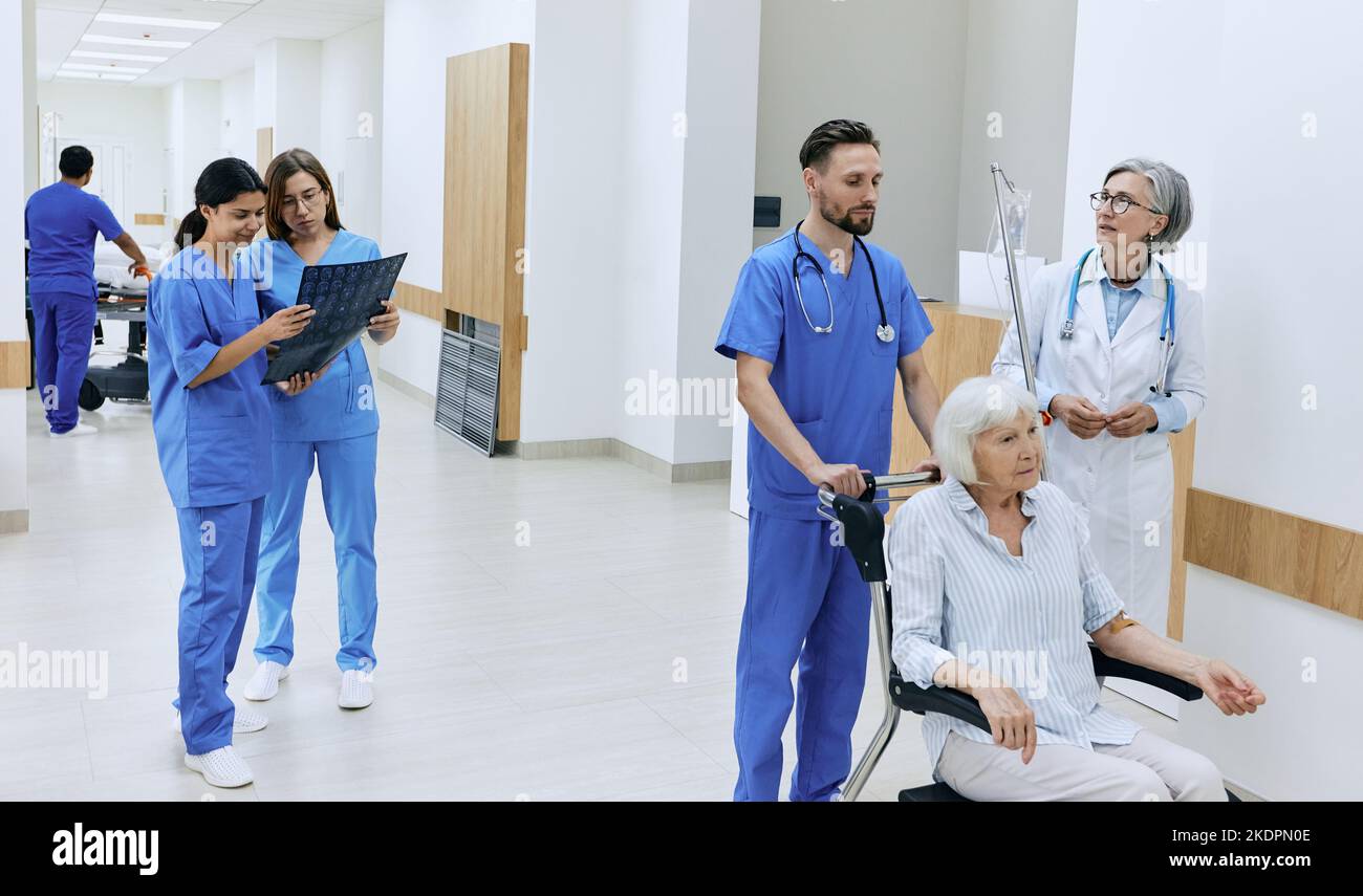 Patient care in hospital. Friendly medical staff take care of health of ...