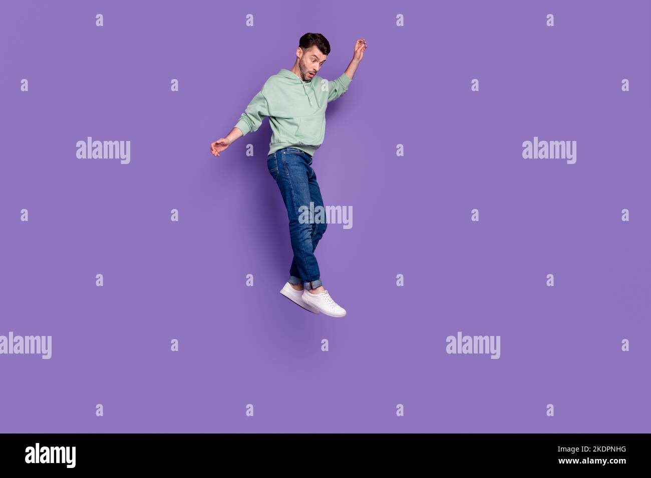 Full length portrait of impressed young person jump falling look down ...