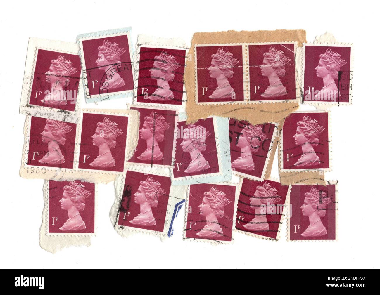 A montage of vintage postage stamps on paper from the United Kingdom ...