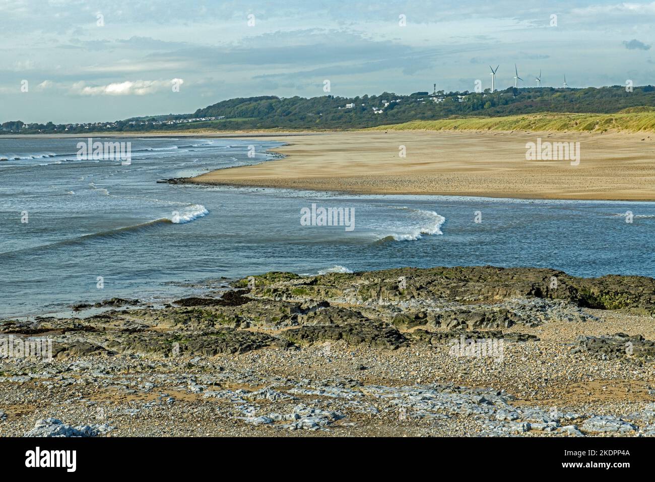 The incoming tide at the mouth or estuary of the River Ogmore at Ogmore ...