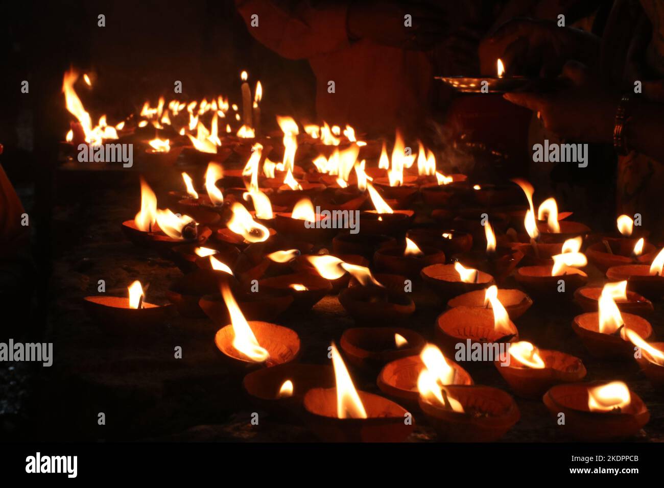 Kolkata, West Bengal, India. 7th Nov, 2022. Hindu women light oil lamps ...