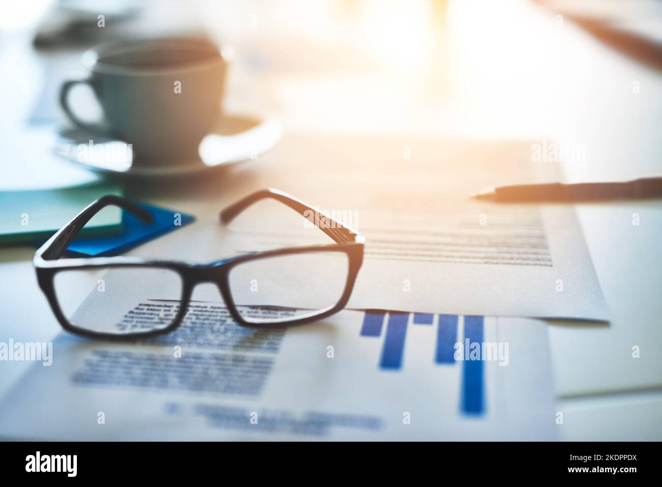 No detail goes unmissed. Closeup shot of spectacles and paperwork on an ...