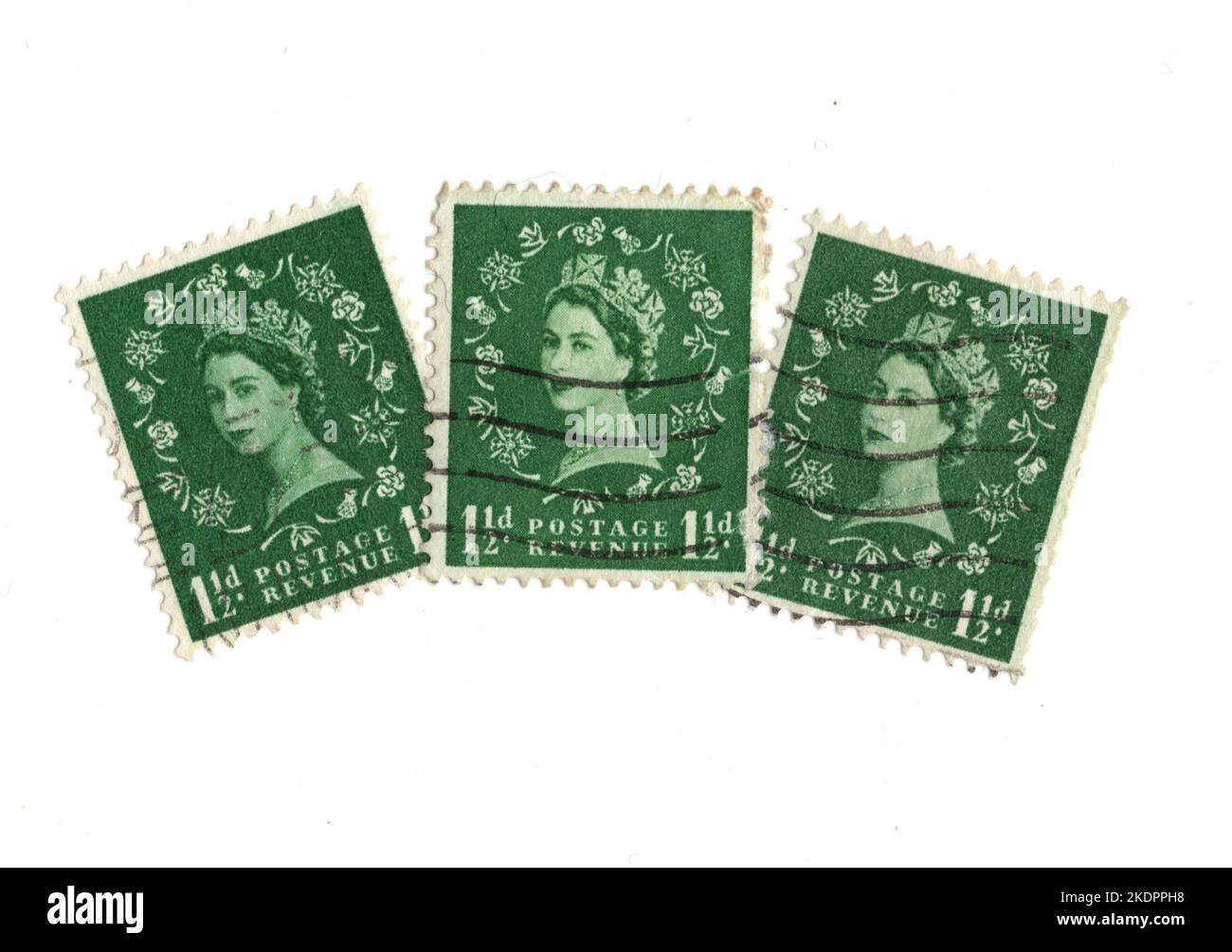 A montage of vintage postage stamps from the United Kingdom on a white ...