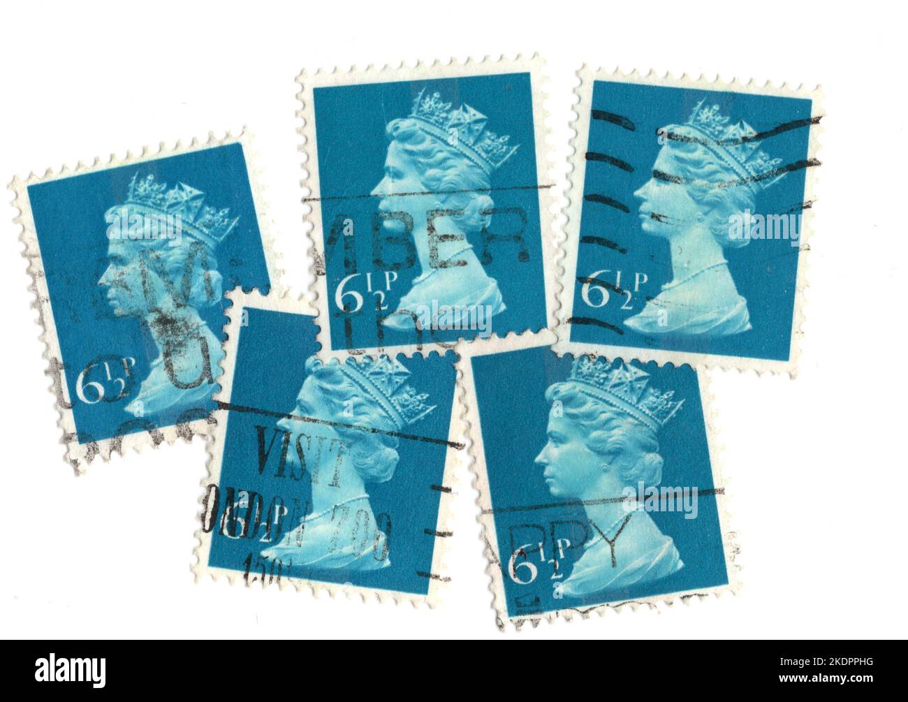 A montage of vintage postage stamps from the United Kingdom on a white ...