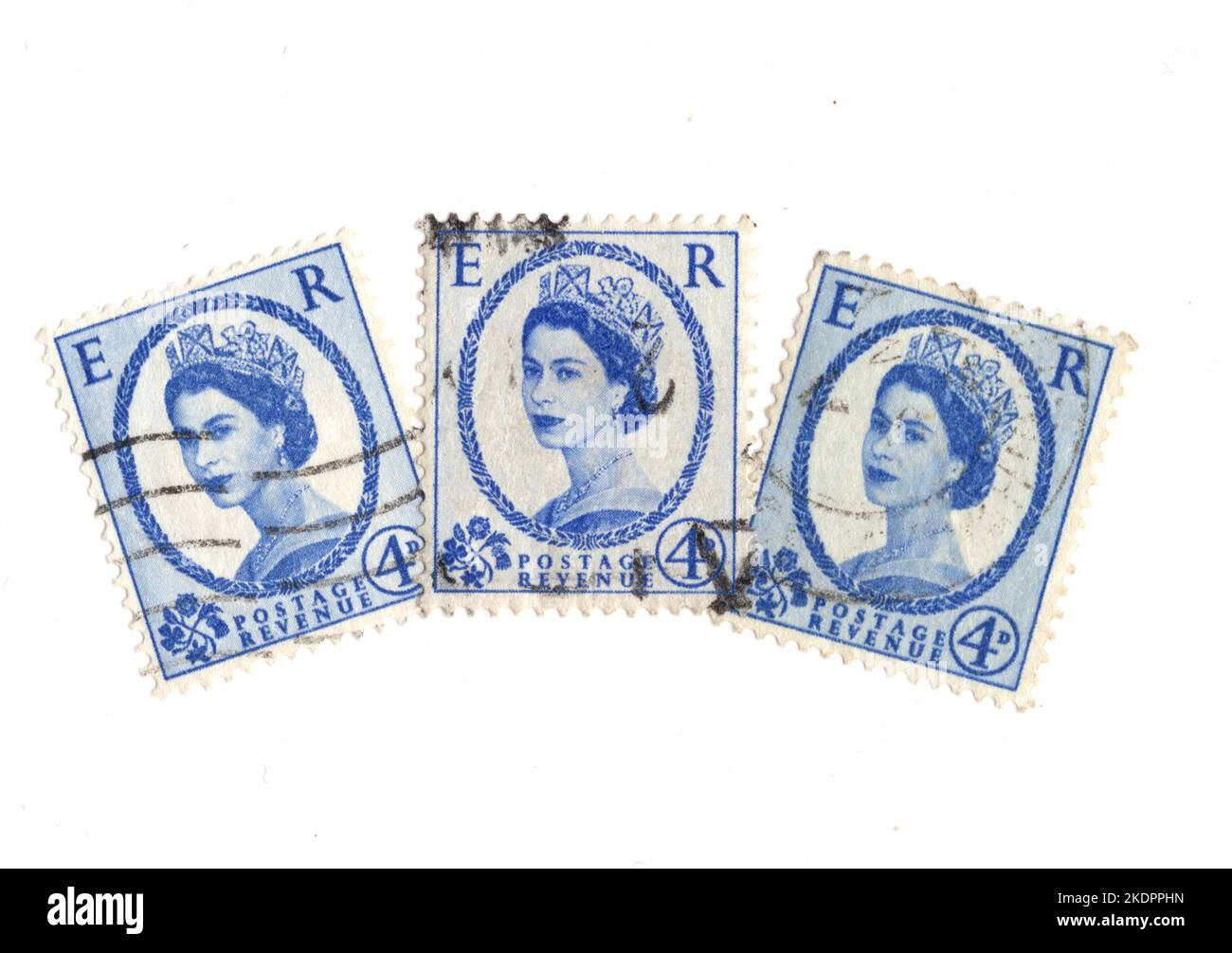 A montage of vintage postage stamps from the United Kingdom on a white ...