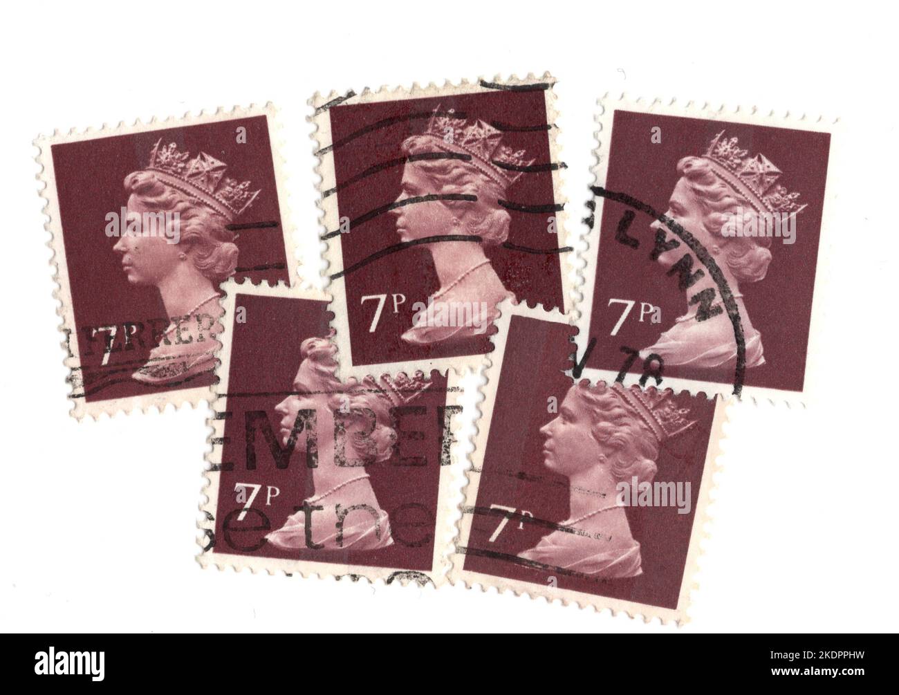 A montage of vintage postage stamps from the United Kingdom on a white ...