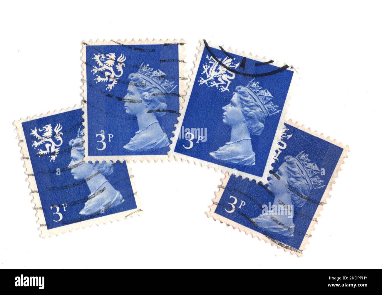 A montage of vintage postage stamps from the United Kingdom on a white ...