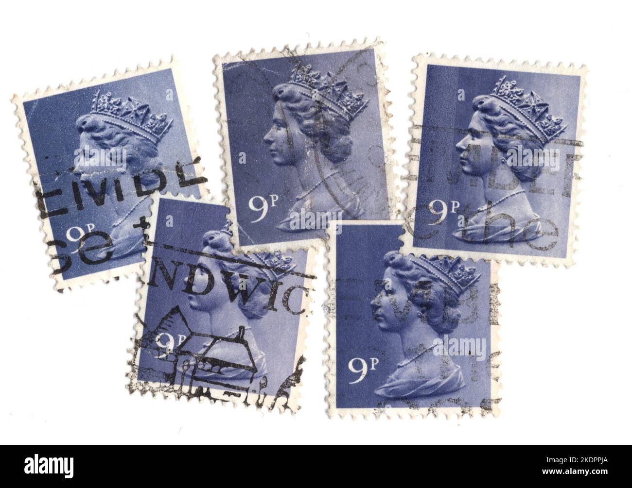 A montage of vintage postage stamps from the United Kingdom on a white ...