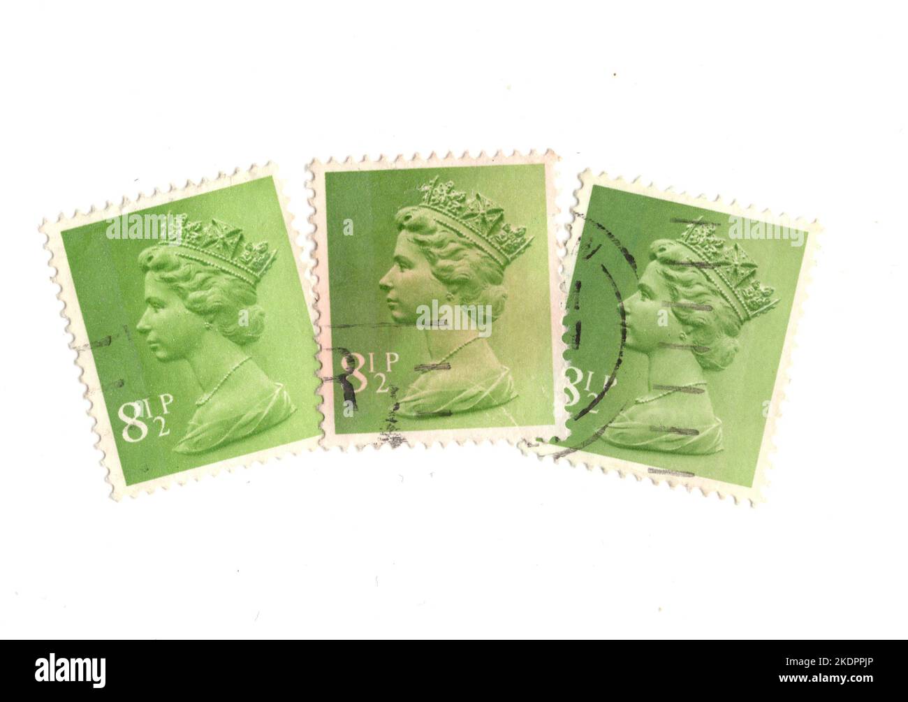 A montage of vintage postage stamps from the United Kingdom on a white ...