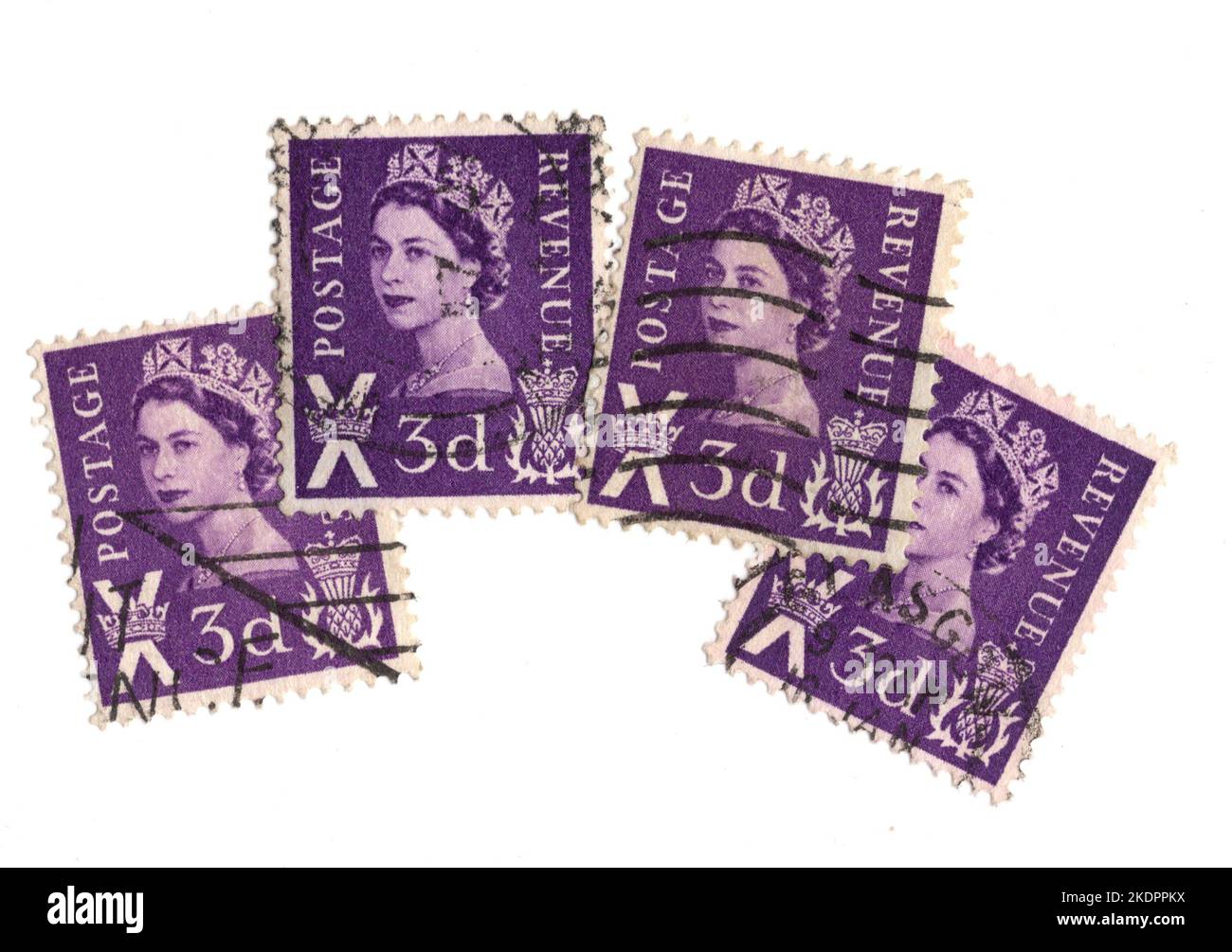 A montage of vintage postage stamps from the United Kingdom on a white ...