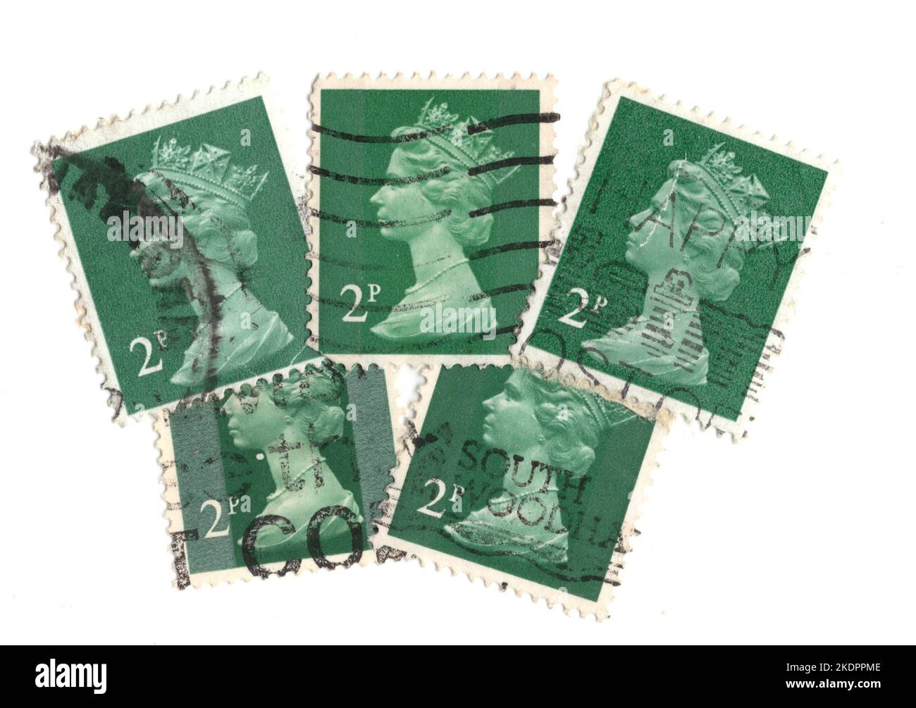 A montage of vintage postage stamps from the United Kingdom on a white ...