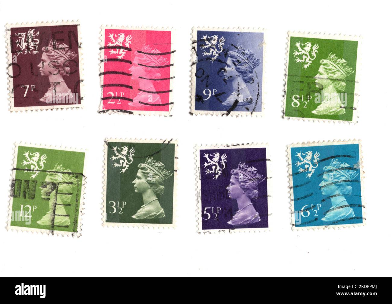 A montage of vintage postage stamps from the United Kingdom on a white ...