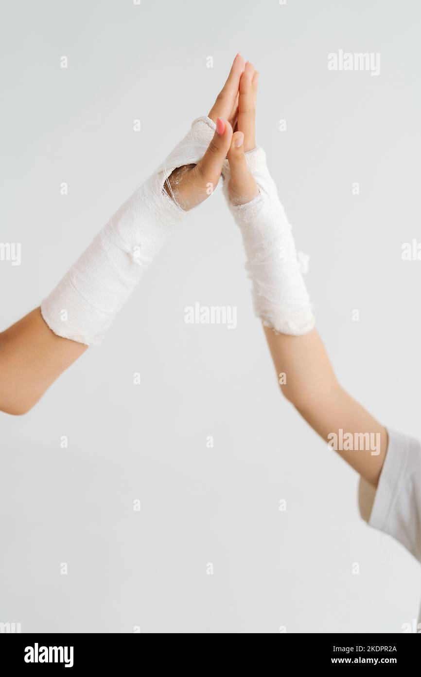 Vertical close-up cropped studio shot of unrecognizable injured woman ... Vertical close-up cropped studio shot of unrecognizable injured woman ...