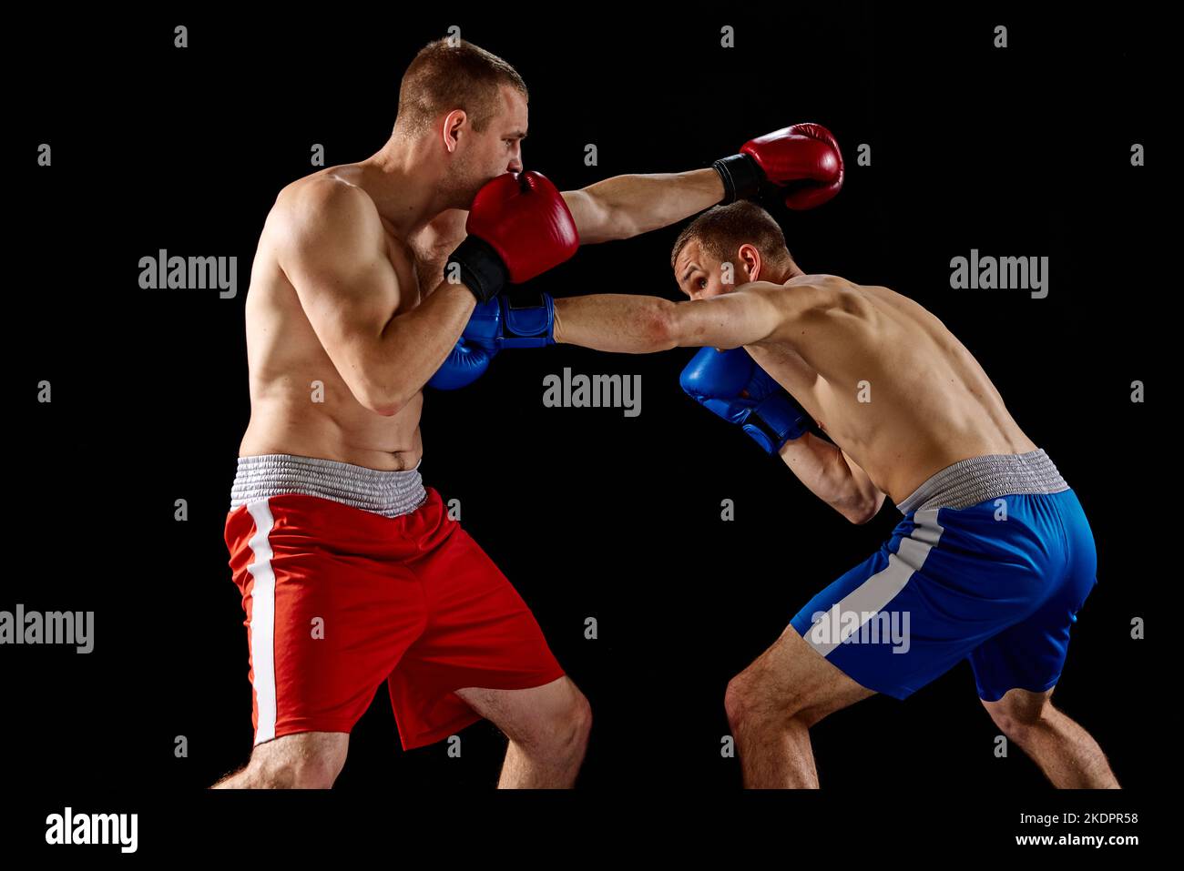 Fight. Dynamic portrait of two professional boxer in sports uniform ...