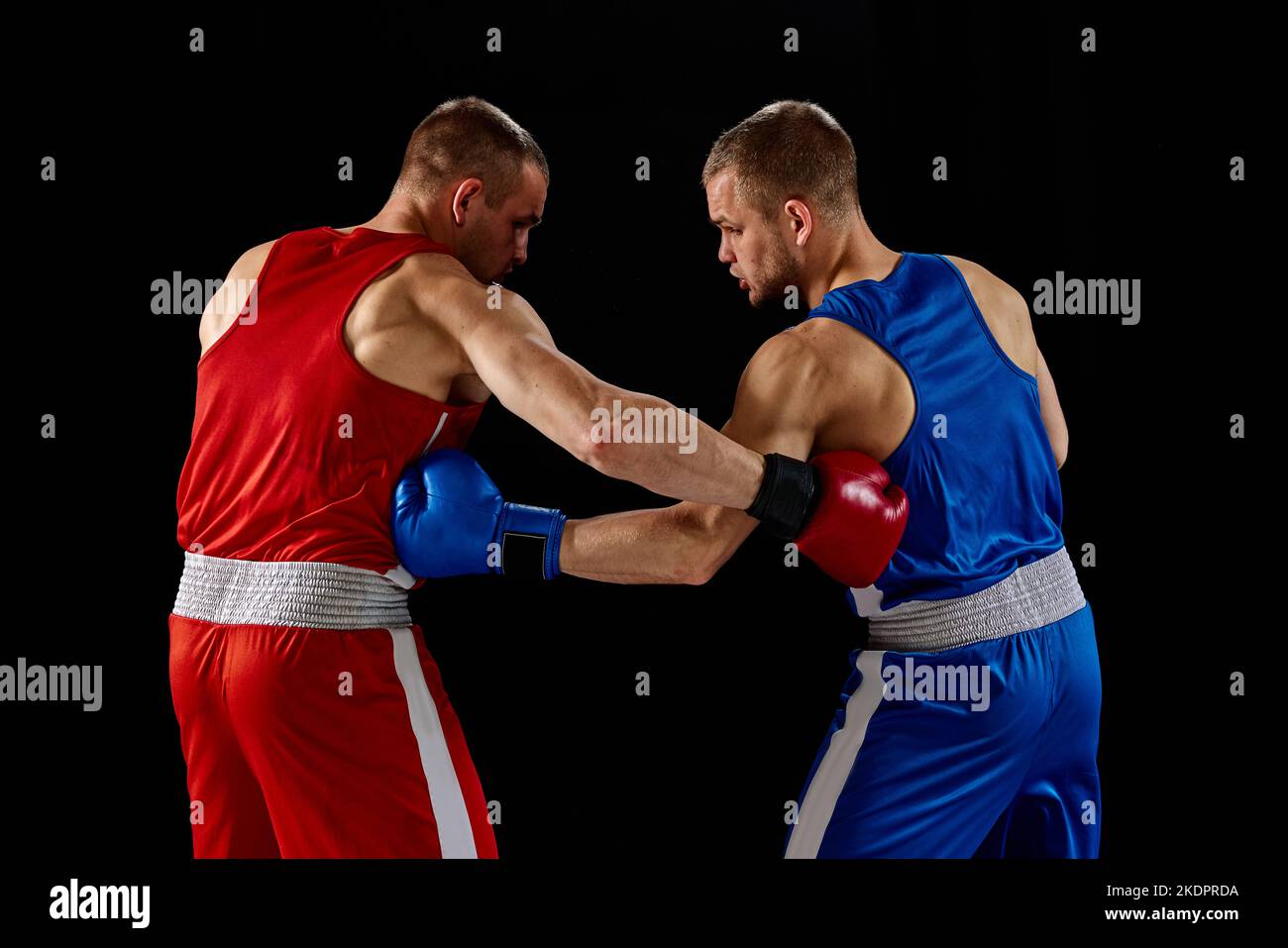 Fight. Dynamic portrait of two professional boxer in sports uniform ...