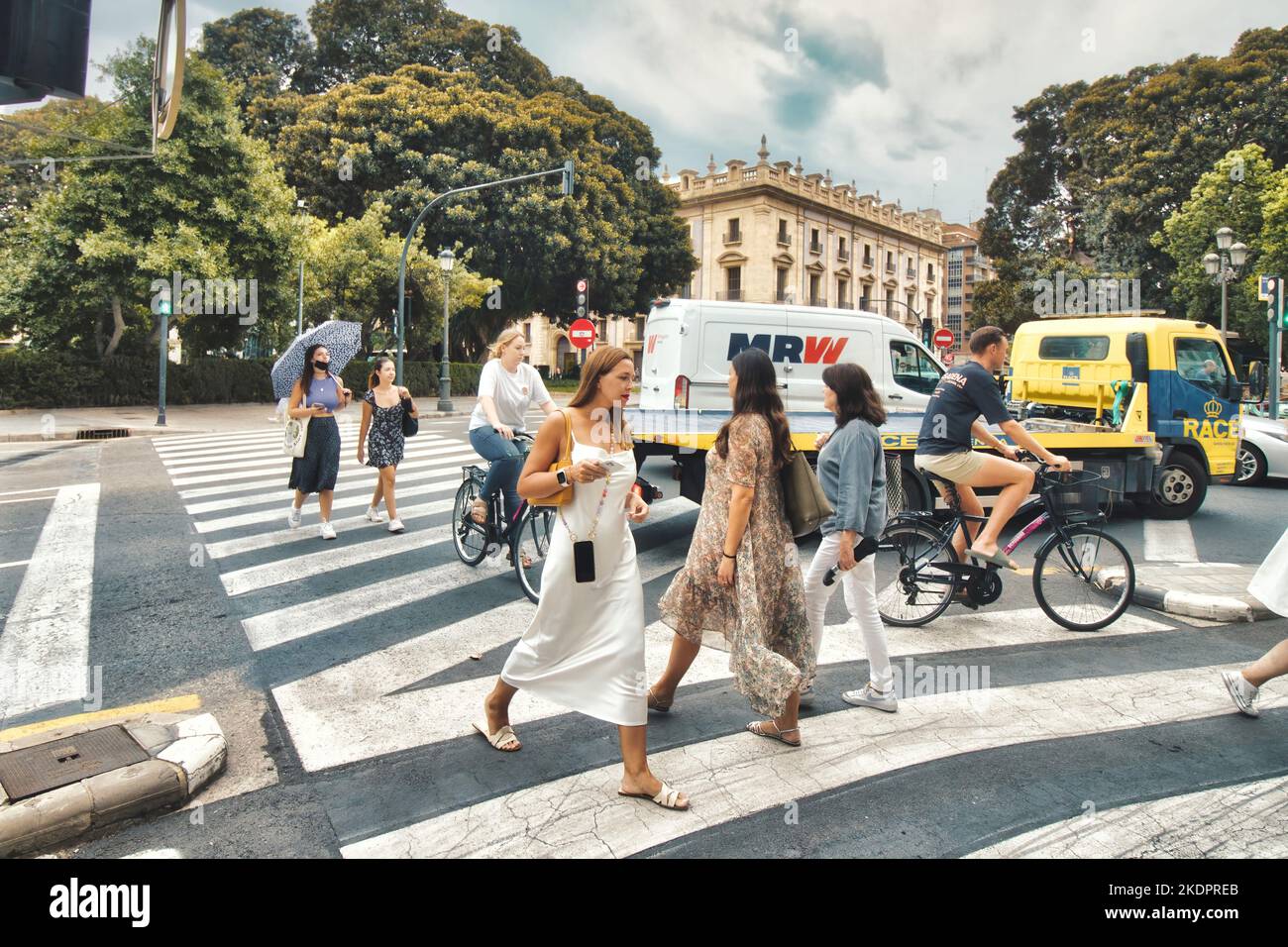 Valencia, Spain - Sept 14 2022: People walking on a pedestrian crossing ...