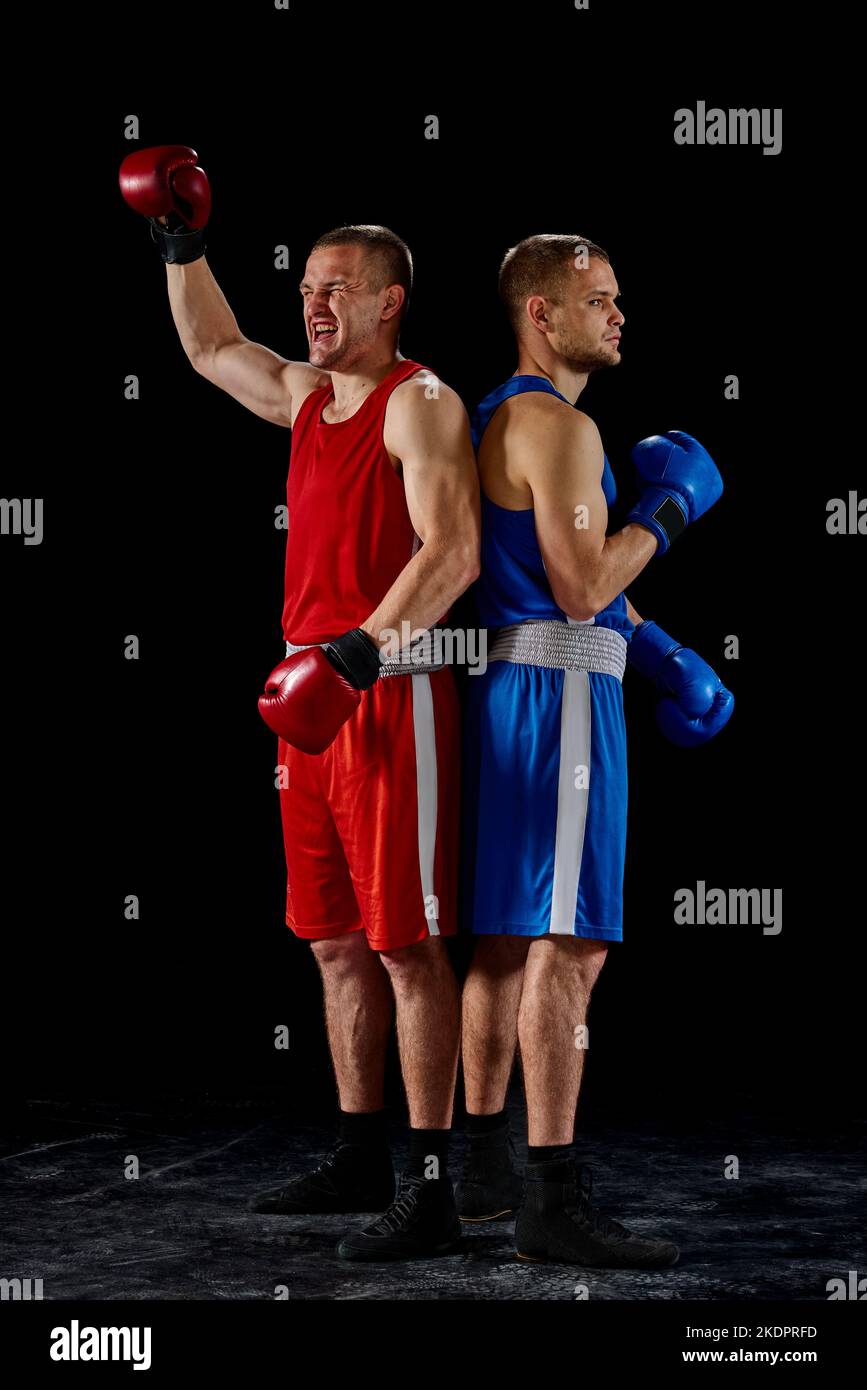 Emotional two twins brothers, professional boxers in blue and red ...