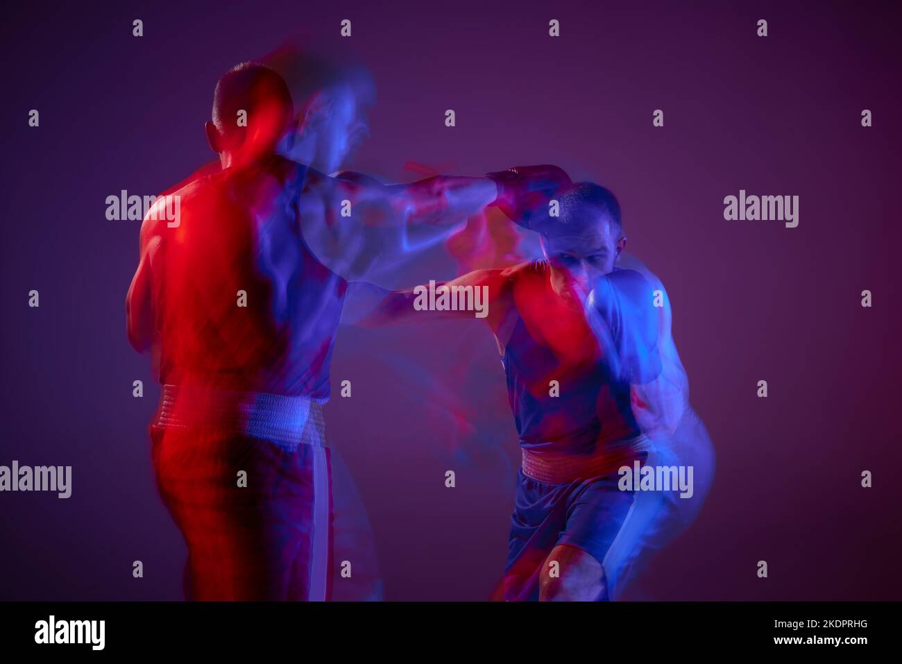 Unfocused effect portrait of two professional boxers boxing isolated on ...