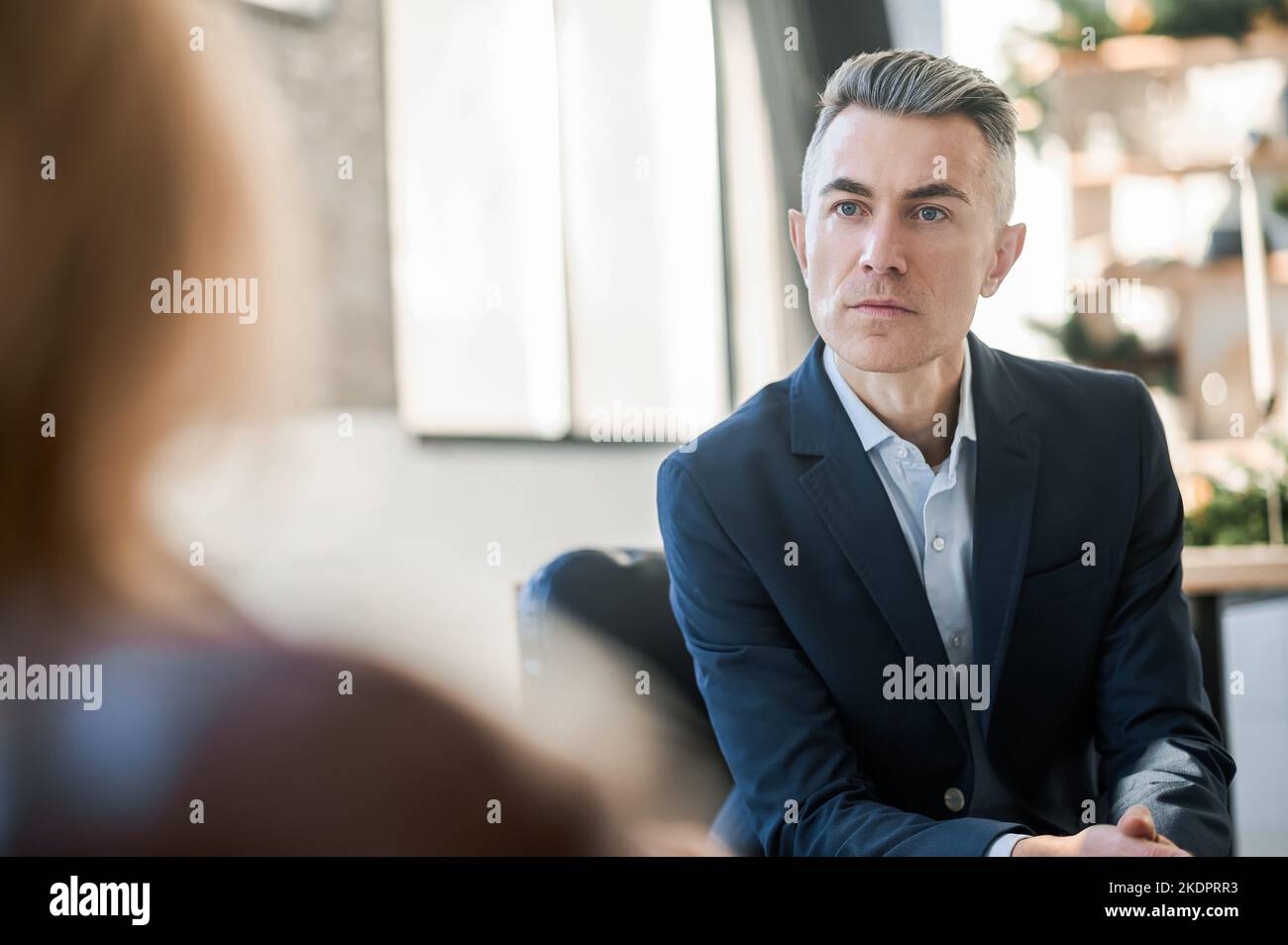 Man sitting opposite woman hi-res stock photography and images - Alamy