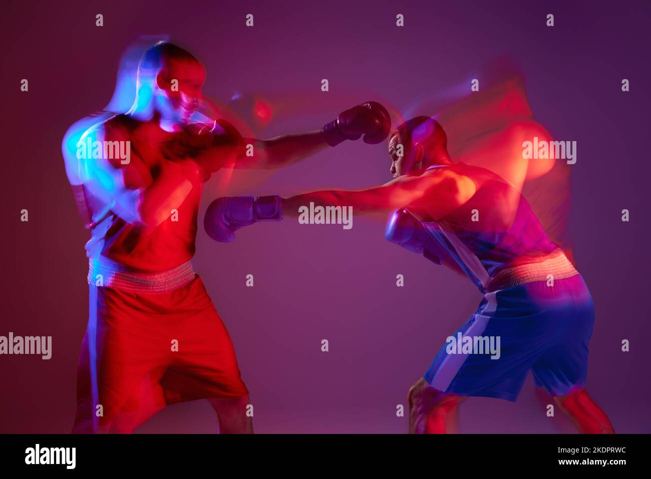 Right hook. Unfocused effect portrait of two professional boxers boxing ...