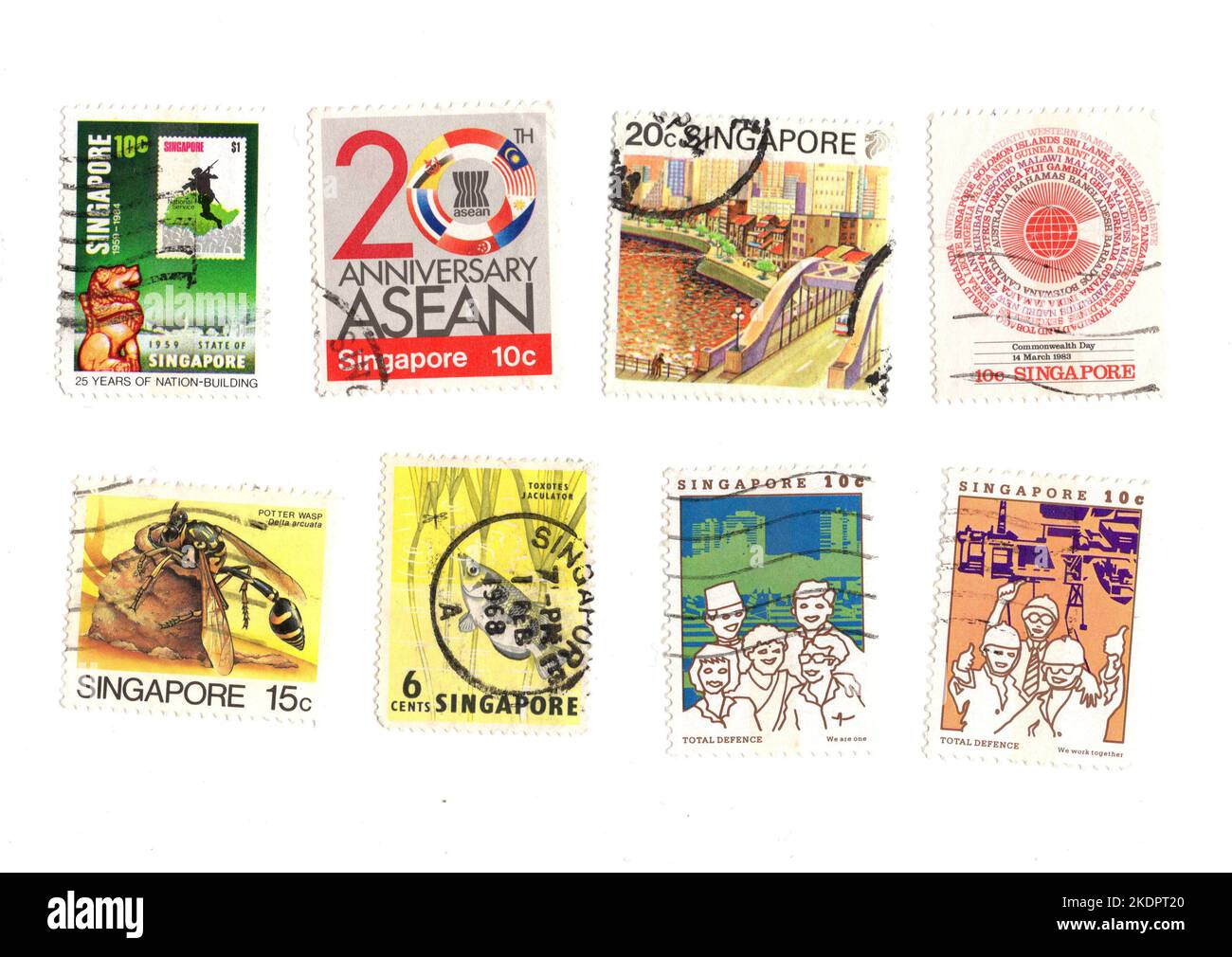 A montage of vintage postage stamps from Singapore on a white ...