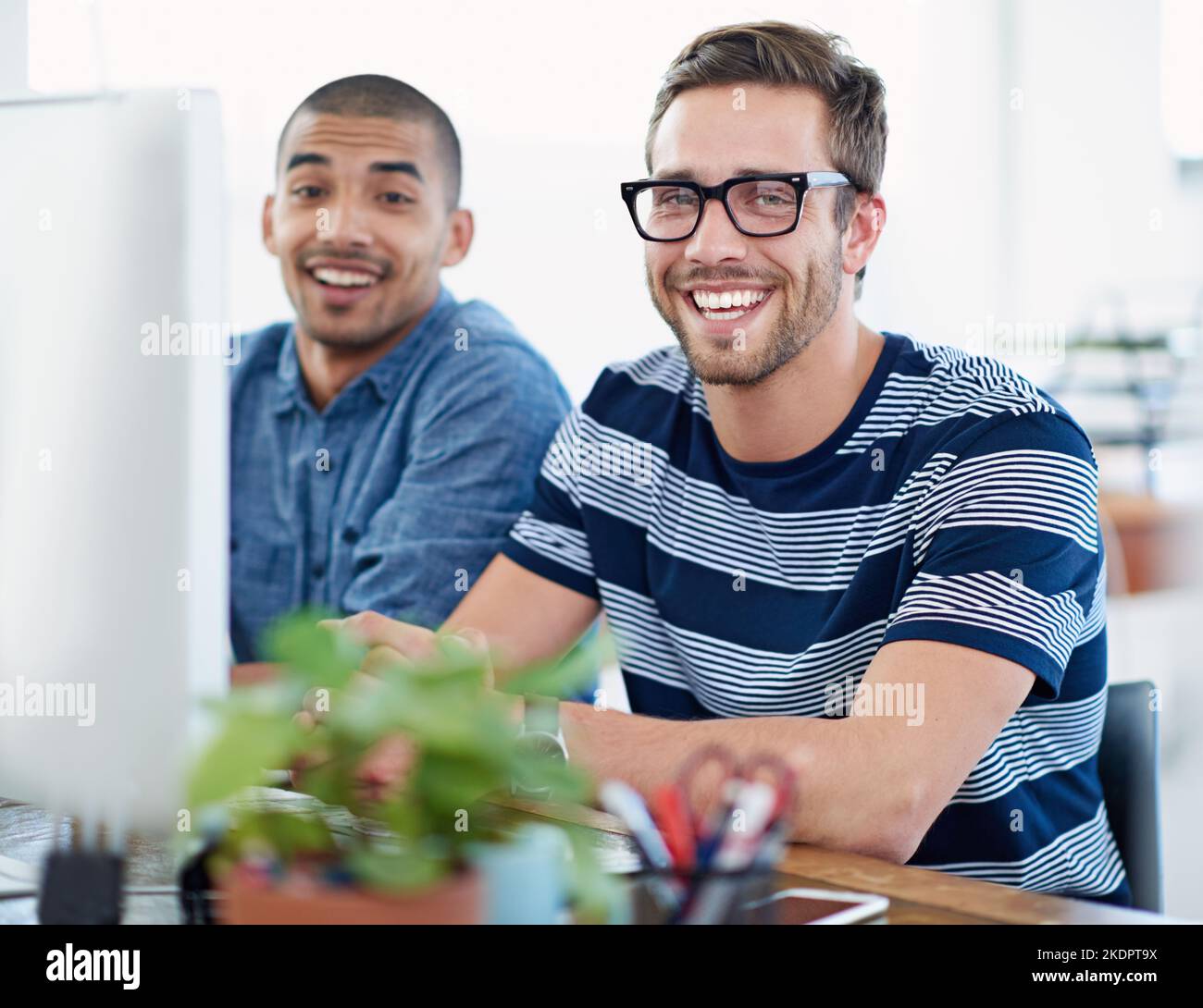 We make a great team. Portrait of two male designers working together ...