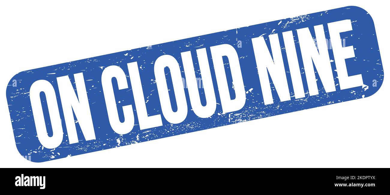 ON CLOUD NINE text written on blue grungy stamp sign Stock Photo - Alamy