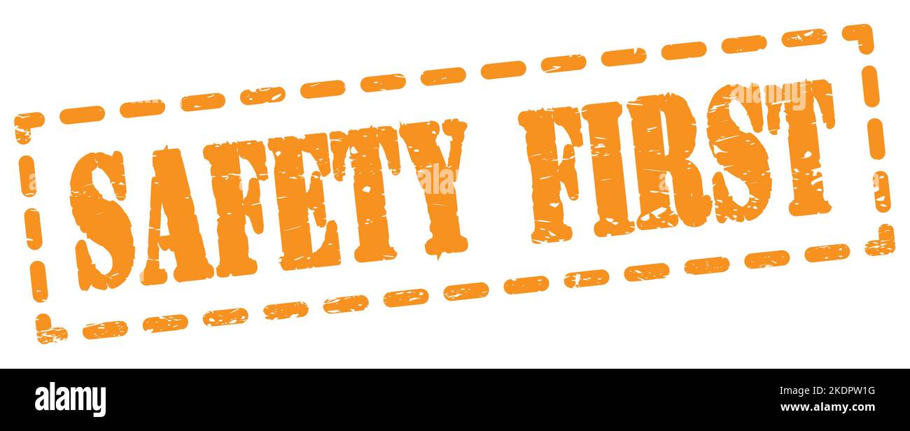 SAFETY FIRST text written on orange dash stamp sign Stock Photo - Alamy