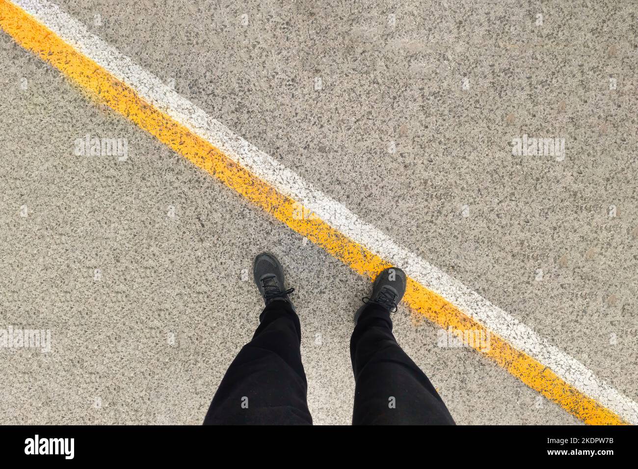 A man standing on a pavement Stock Photo - Alamy