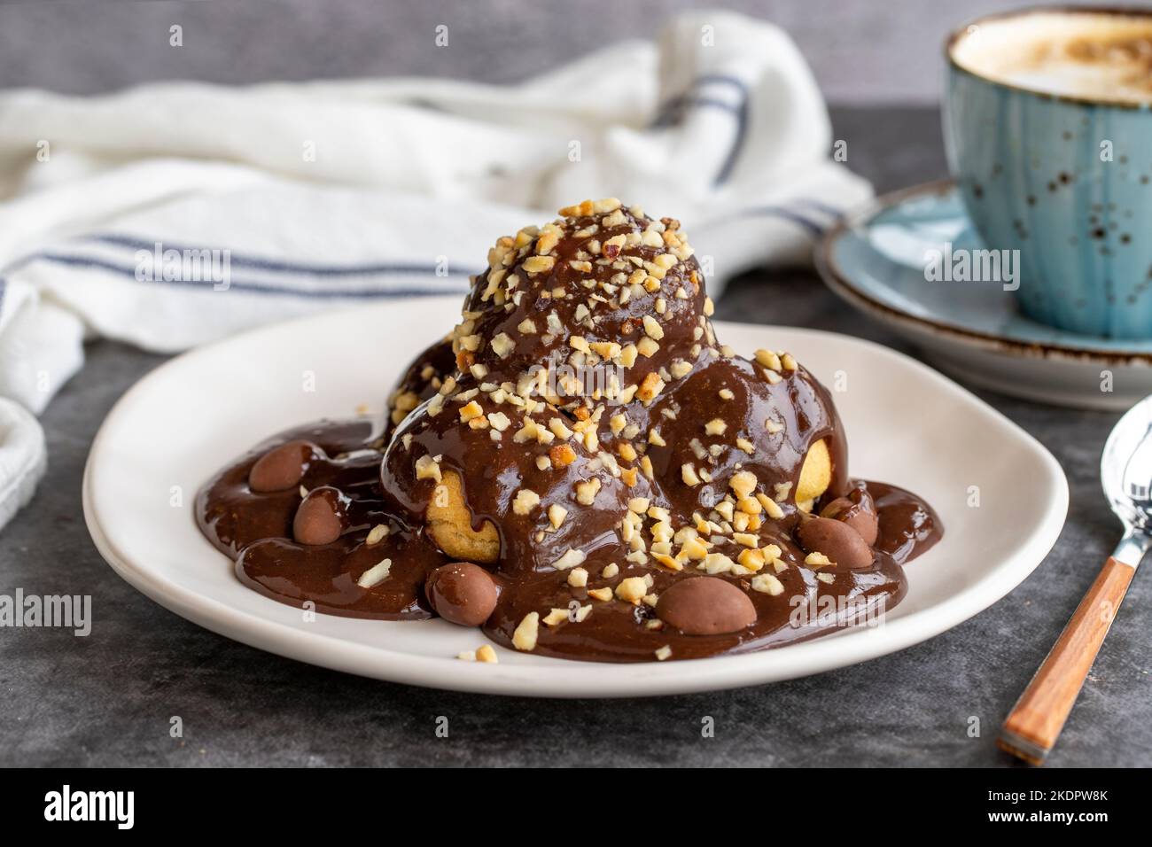 Profiterole dessert on dark background. Traditional french cuisine ...