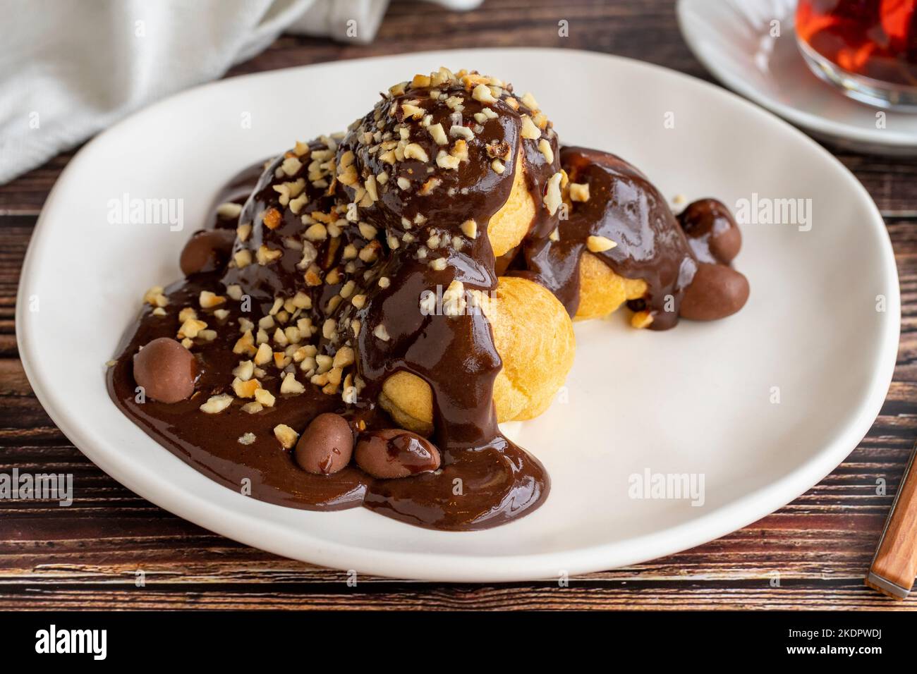 Profiterole dessert on wood background. Traditional french cuisine ...