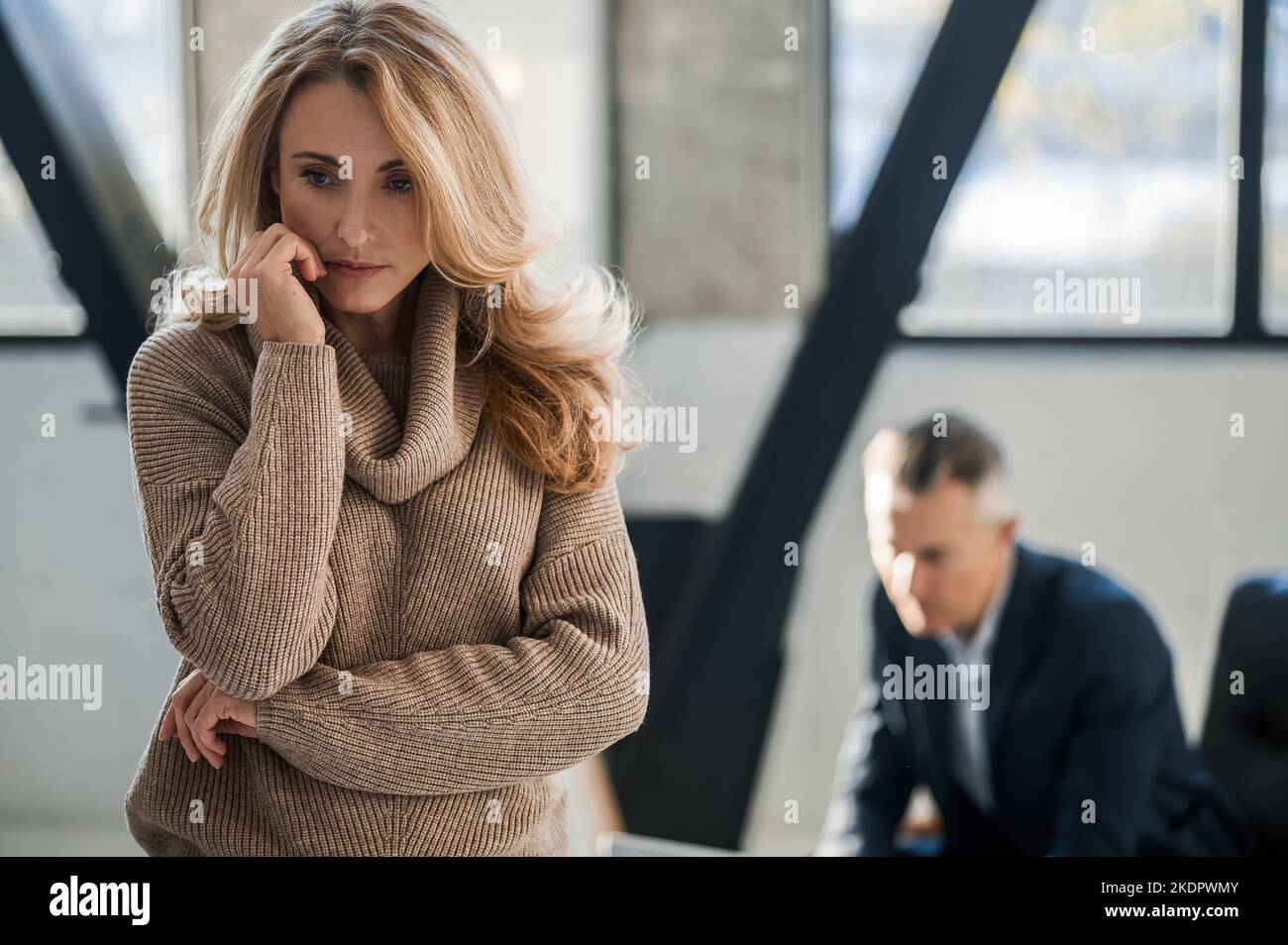 Blonde woman looking stressed and upset Stock Photo - Alamy