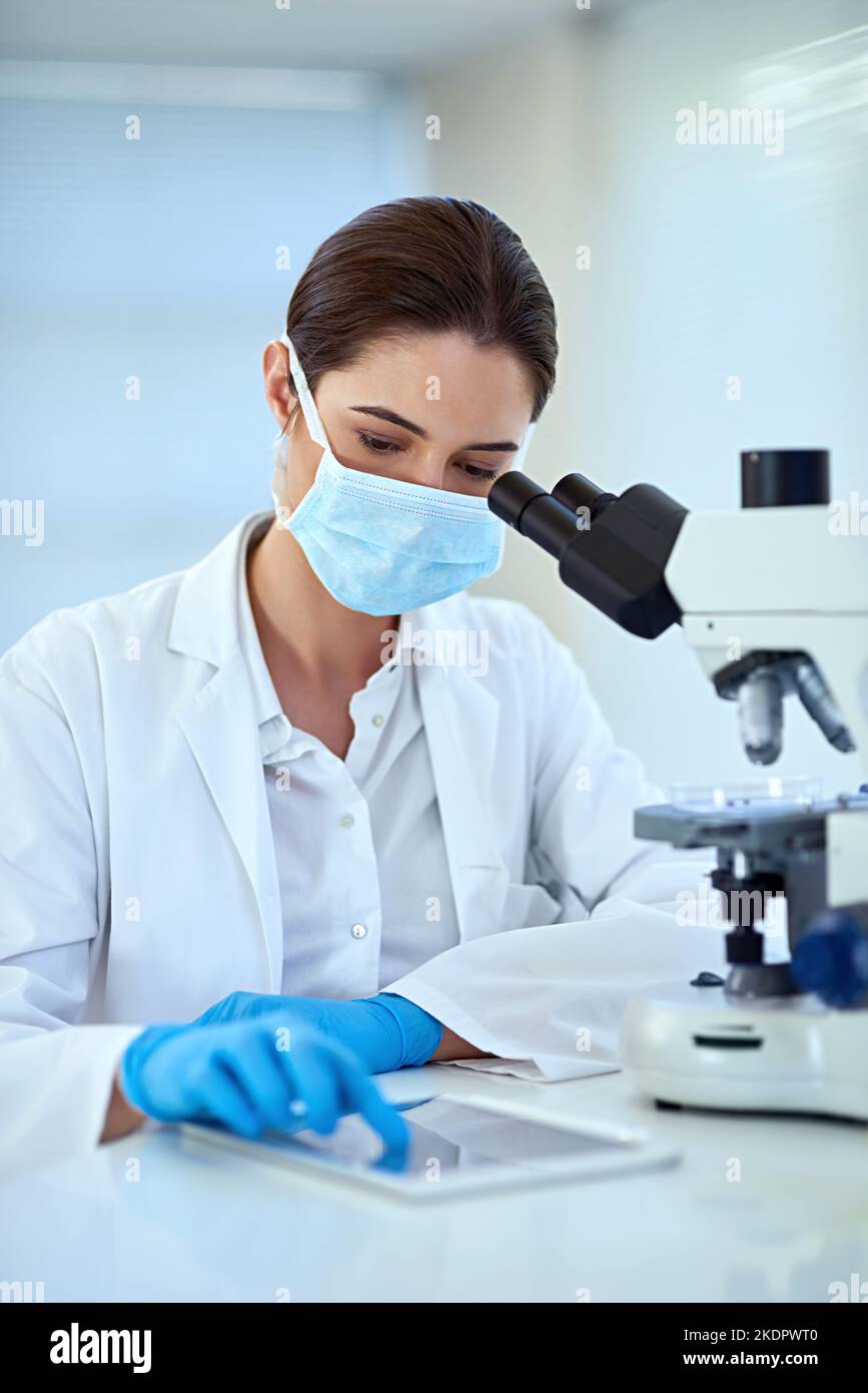 Technology is a vital tool for every researcher. a female scientist ...