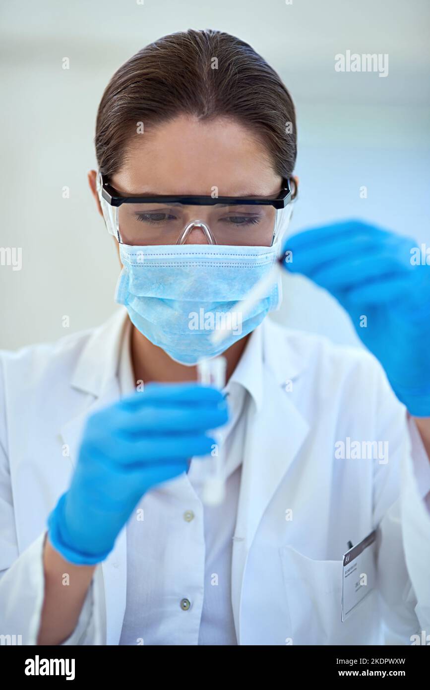 Research that will save lives. a female scientist working alone in the ...
