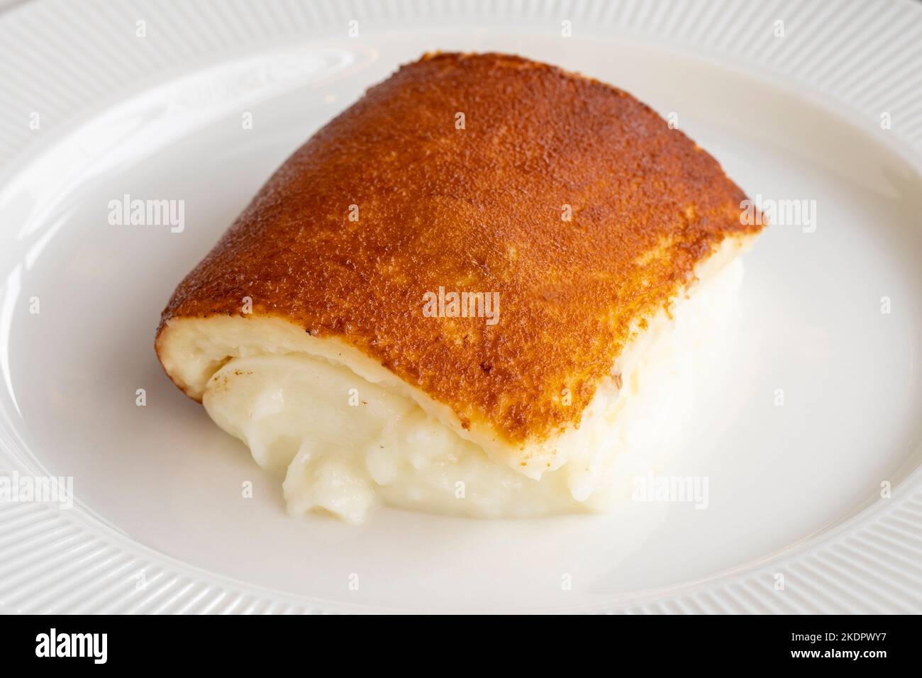 Kazandibi dessert on a dark background. Milky dessert. Traditional ...