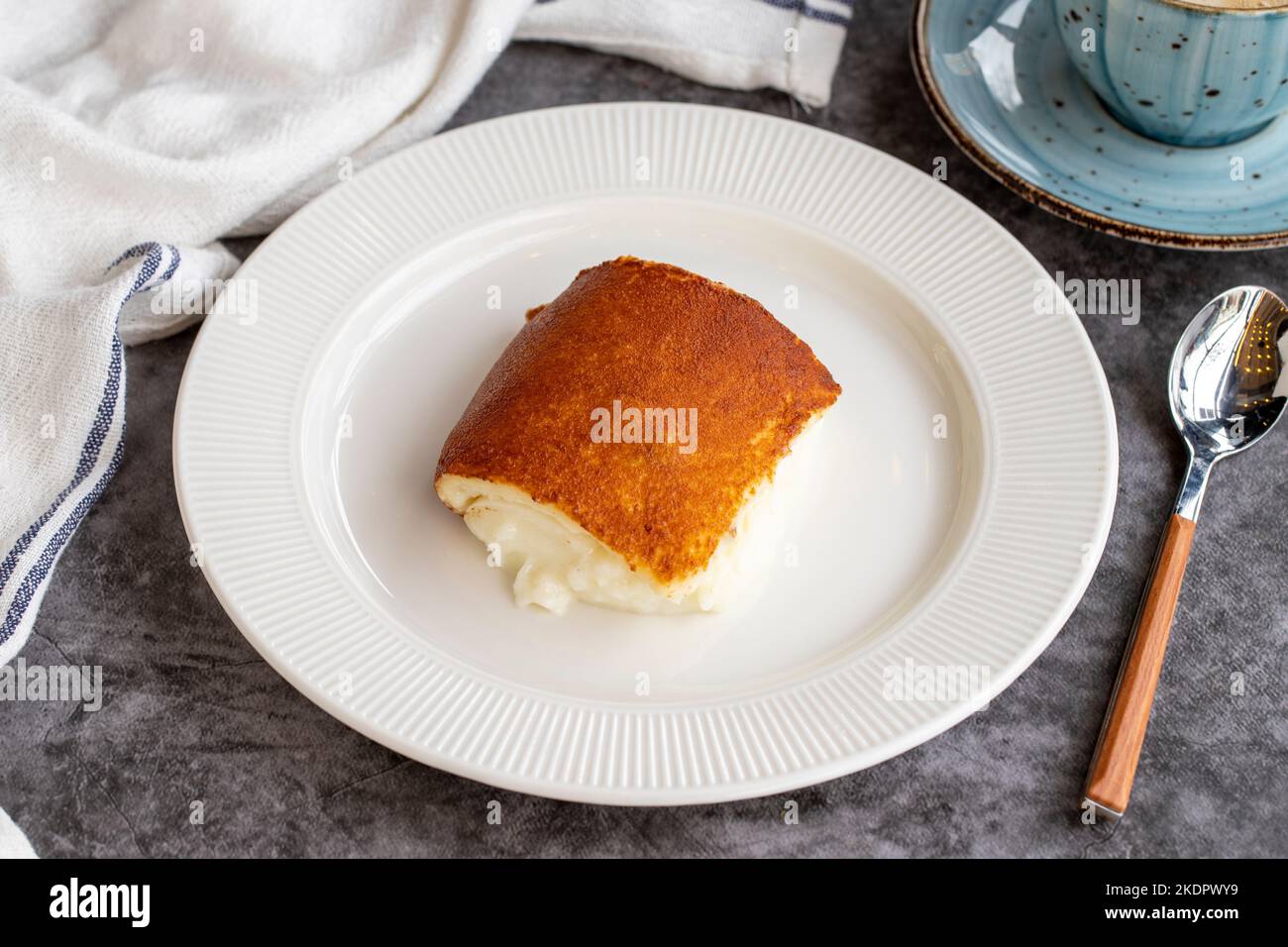 Kazandibi dessert on a dark background. Milky dessert. Traditional ...