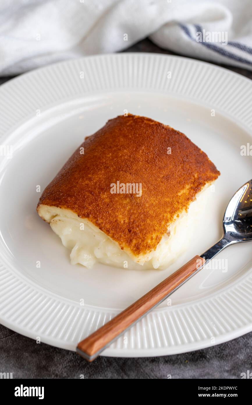 Kazandibi dessert on a dark background. Milky dessert. Traditional ...