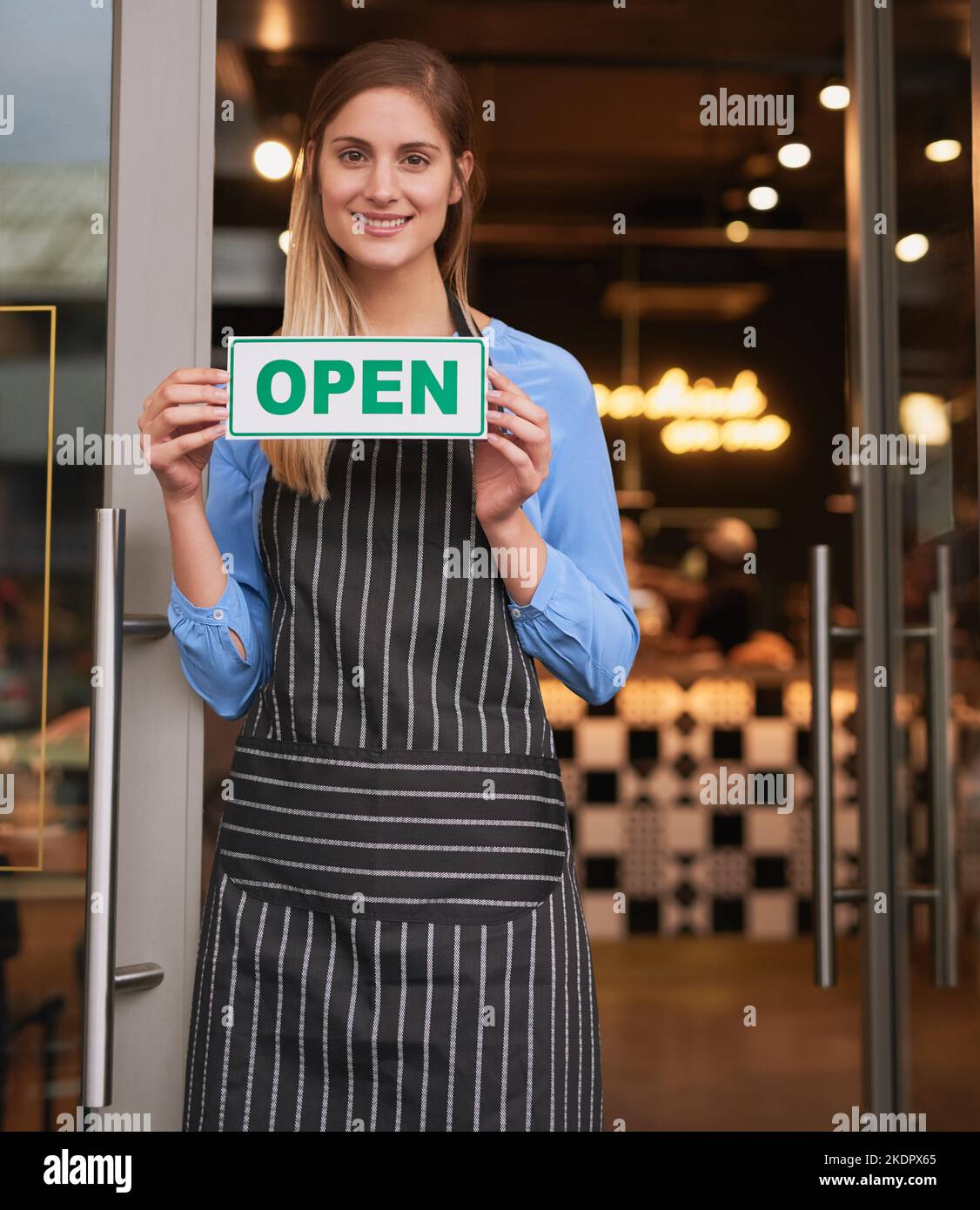 Now open. Cropped portrait of an attractive young woman opening up her ...
