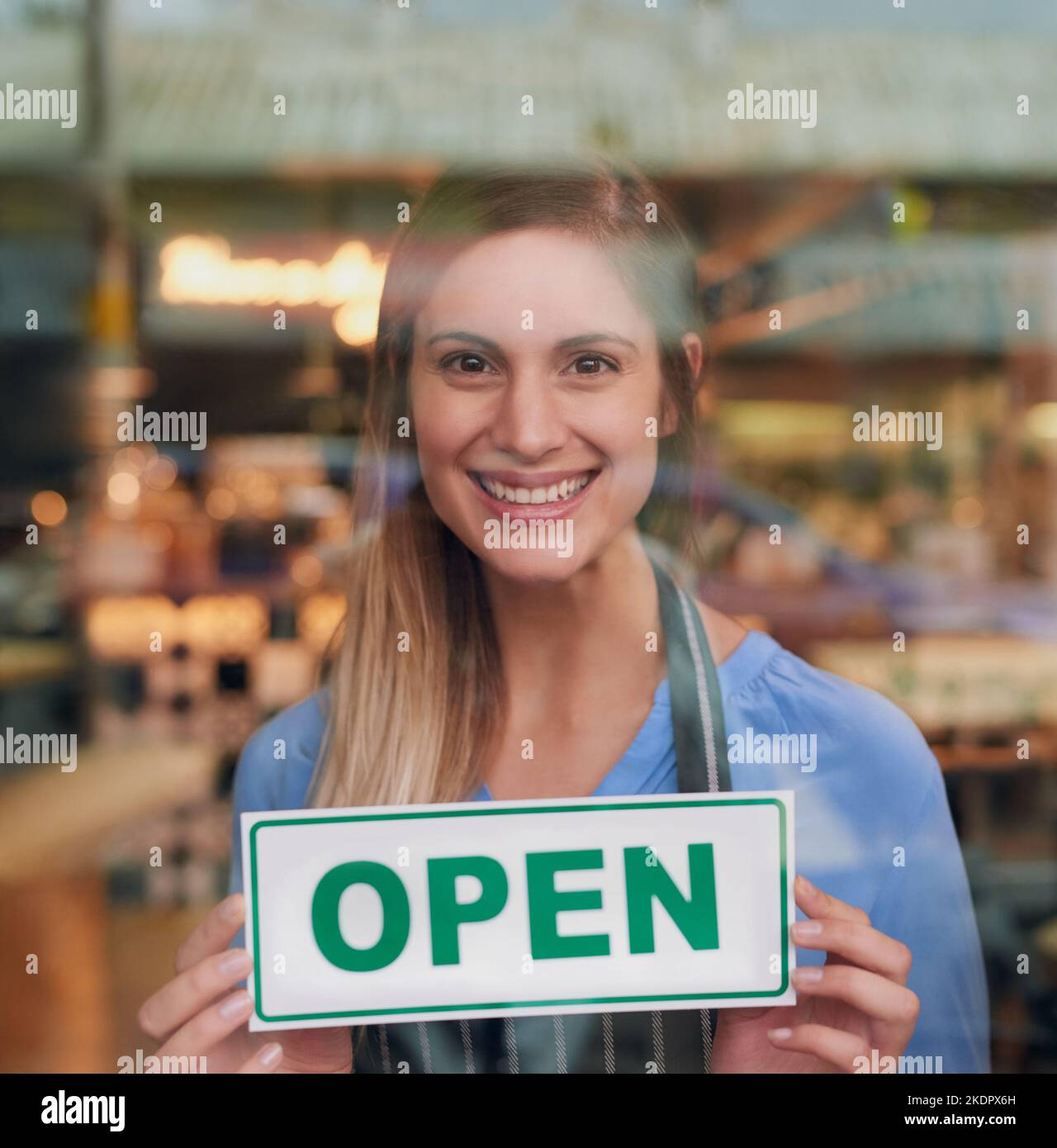 The grand opening. Cropped portrait of an attractive young woman ...