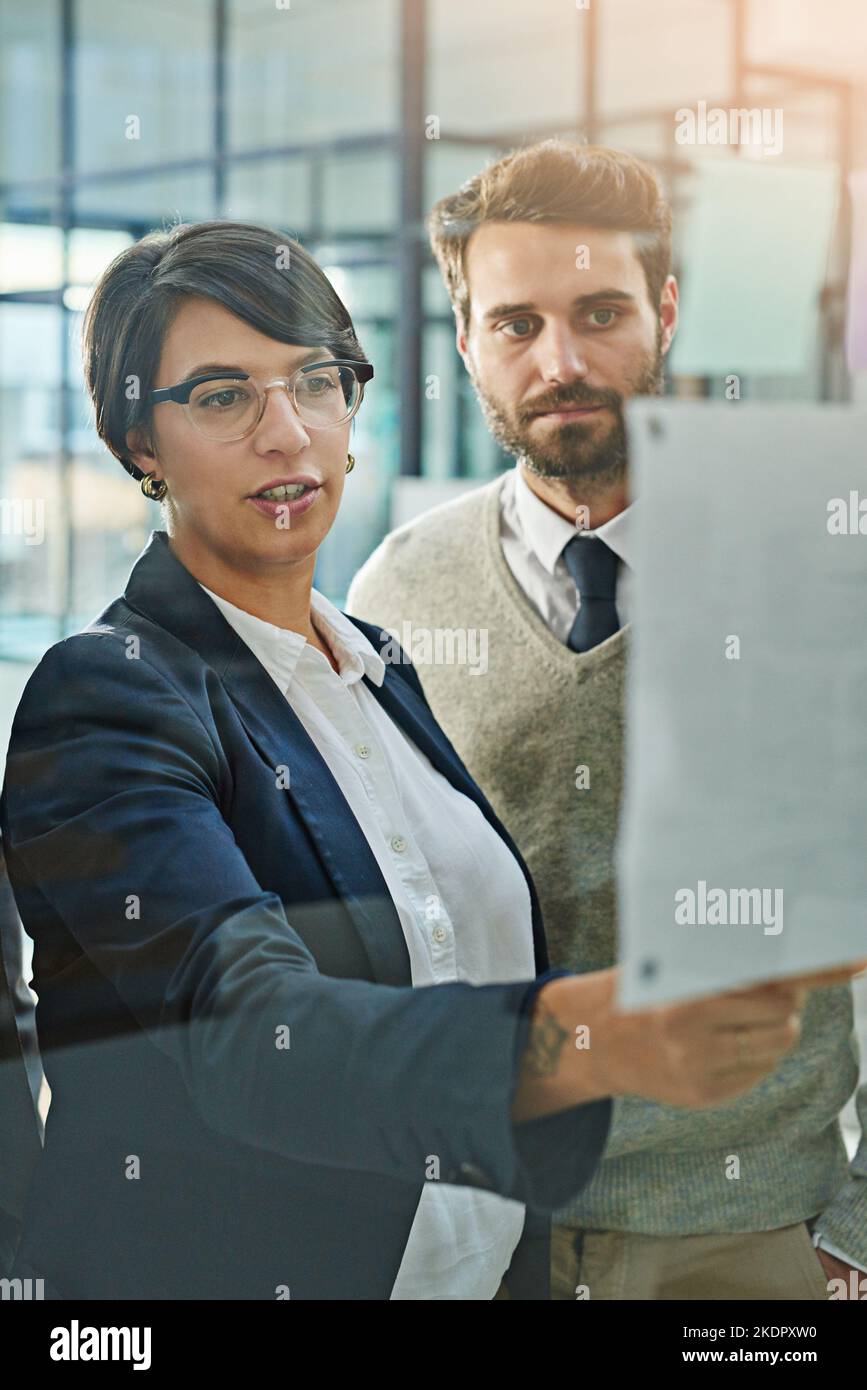 Leave nothing to chance. businesspeople brainstorming together in an ...