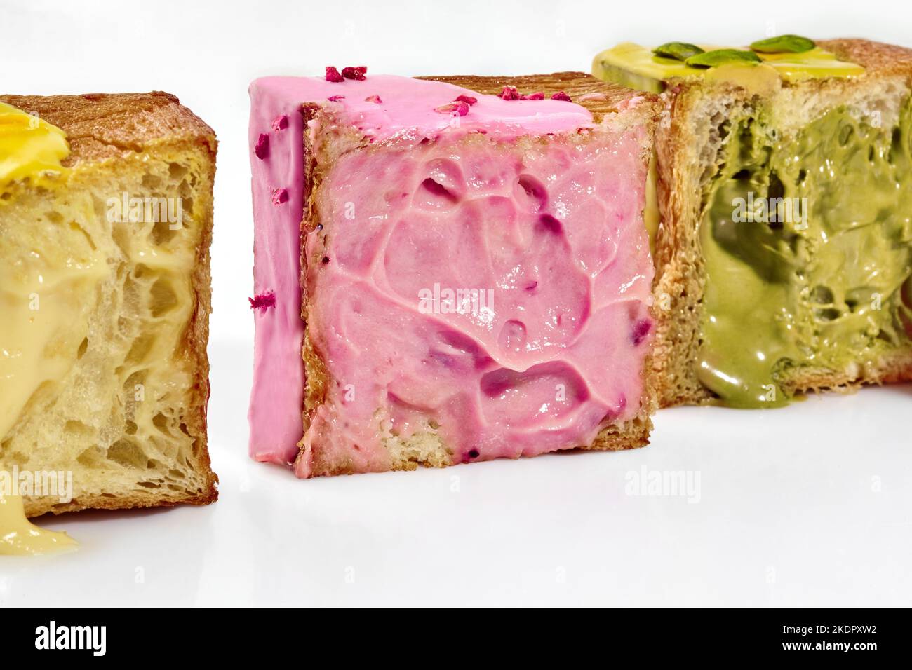 Sliced cube shaped croissants with sweet berry cream, vanilla and ...