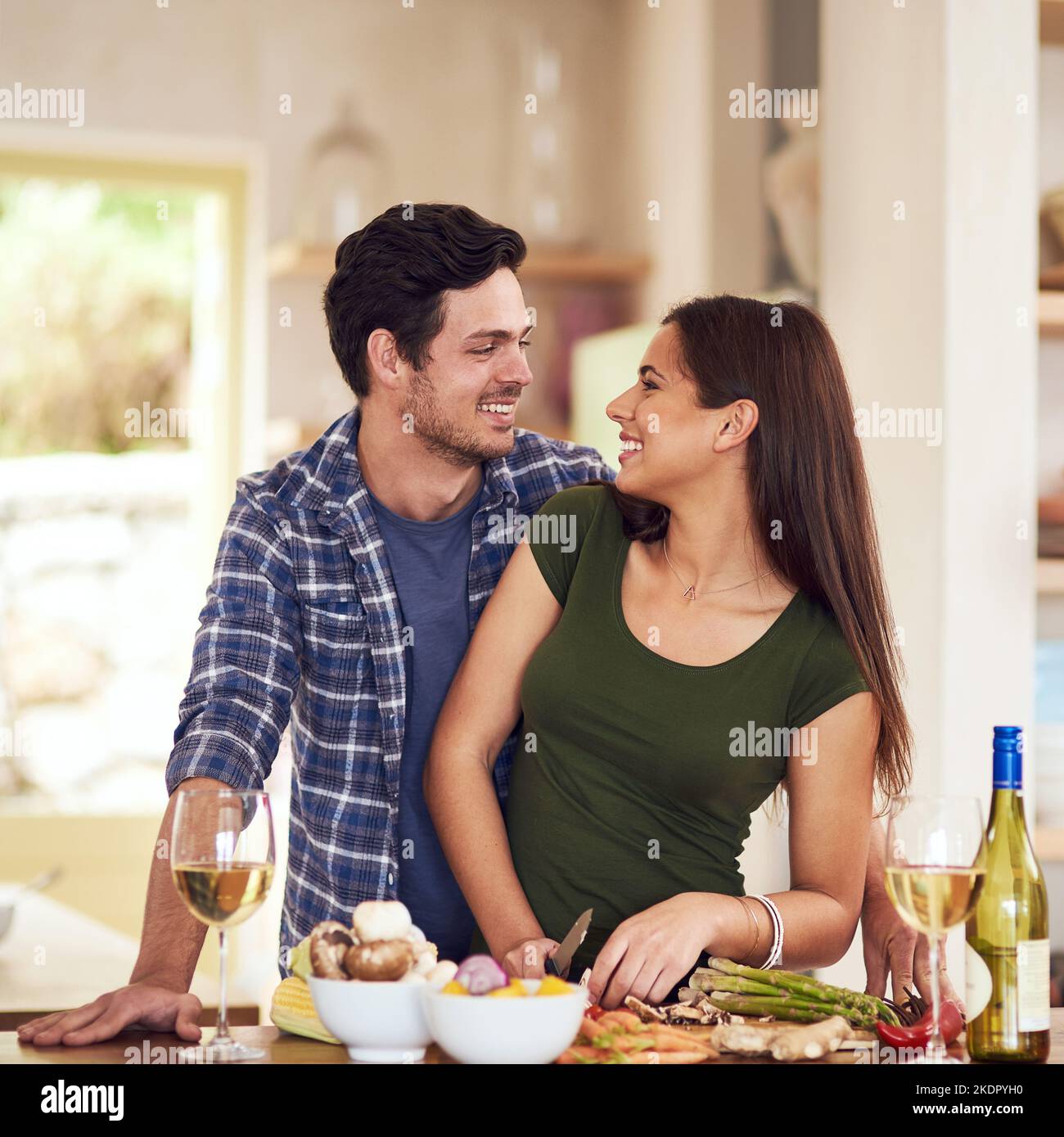 Whats cooking, good looking. a young couple preparing dinner together ...