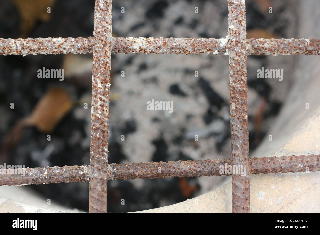 Rusted barrier made out of old steel metal rebars creating a repeating ...