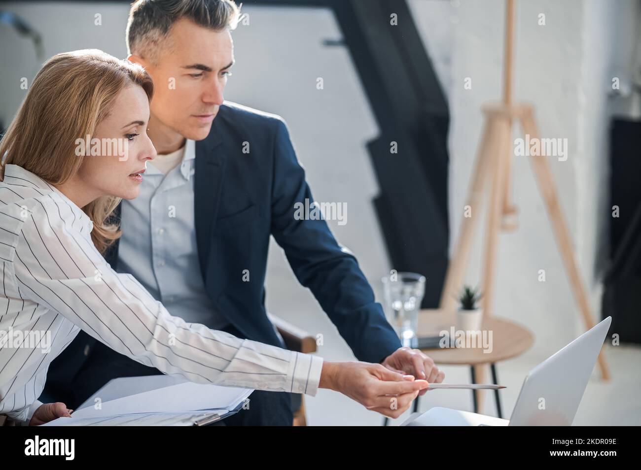 Two colleagues working on the project together Stock Photo - Alamy