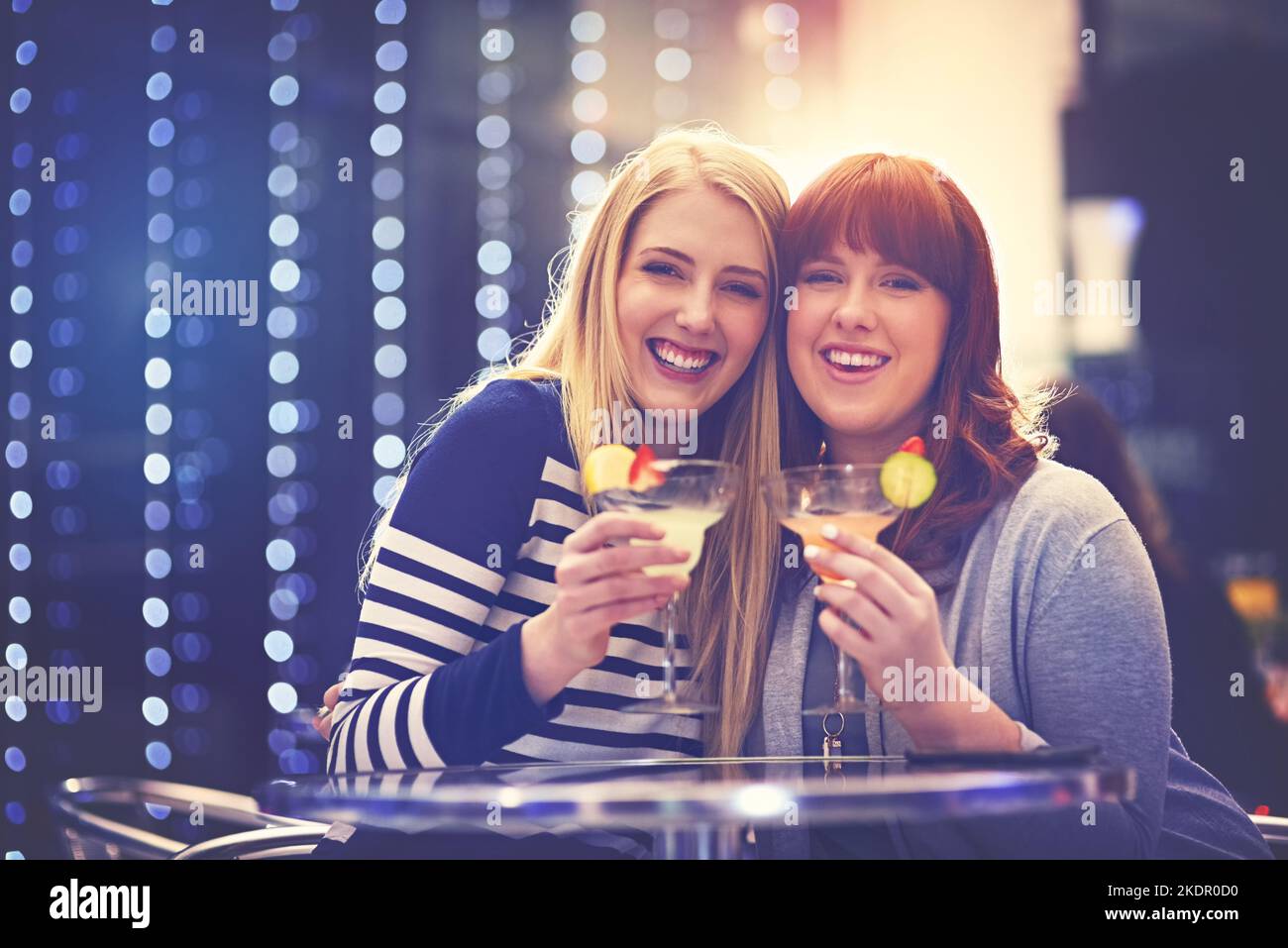 Girls night is our night. Portrait of two friends enjoying cocktails in ...