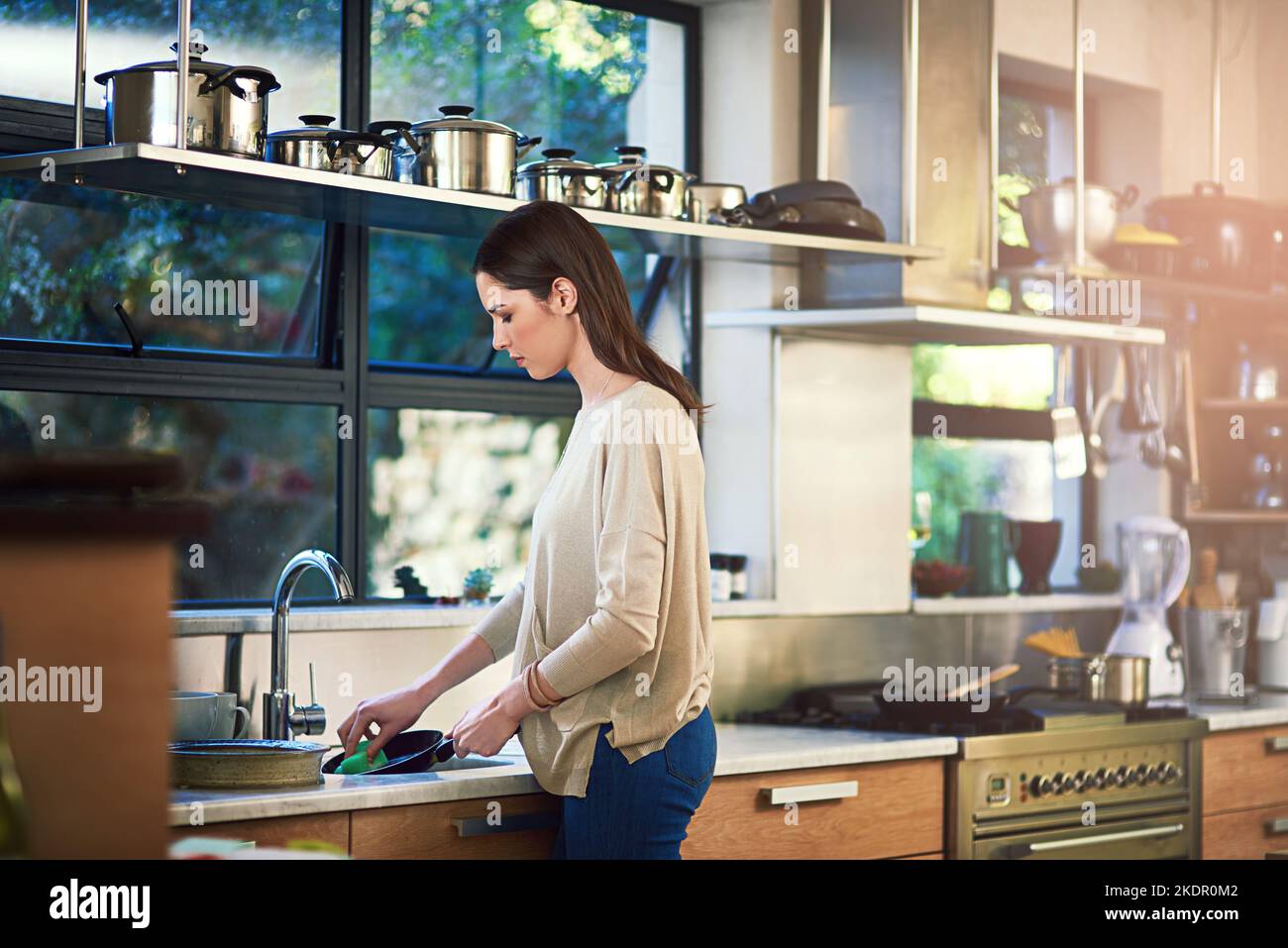 Woman tidying up home hi-res stock photography and images - Alamy