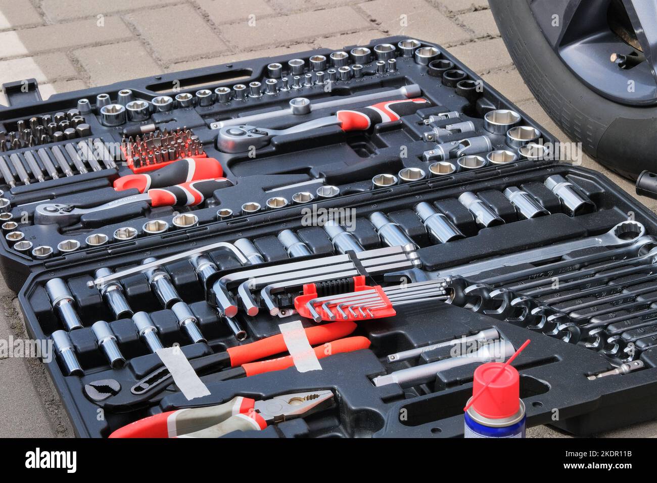Tool set in box near the orange auto. Different tools for repairing and ...